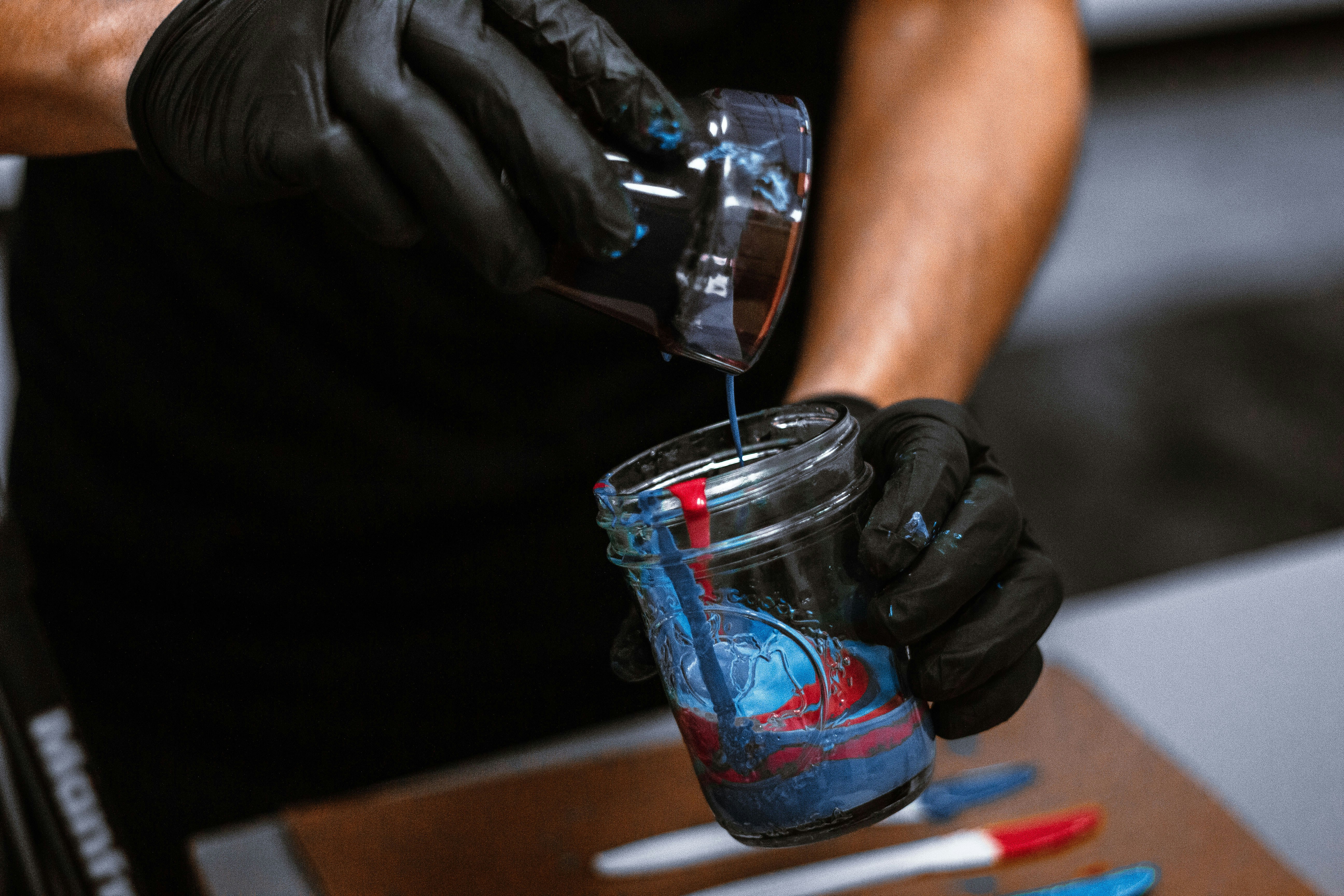 Hands at Work: Pouring Paint Into a Jar