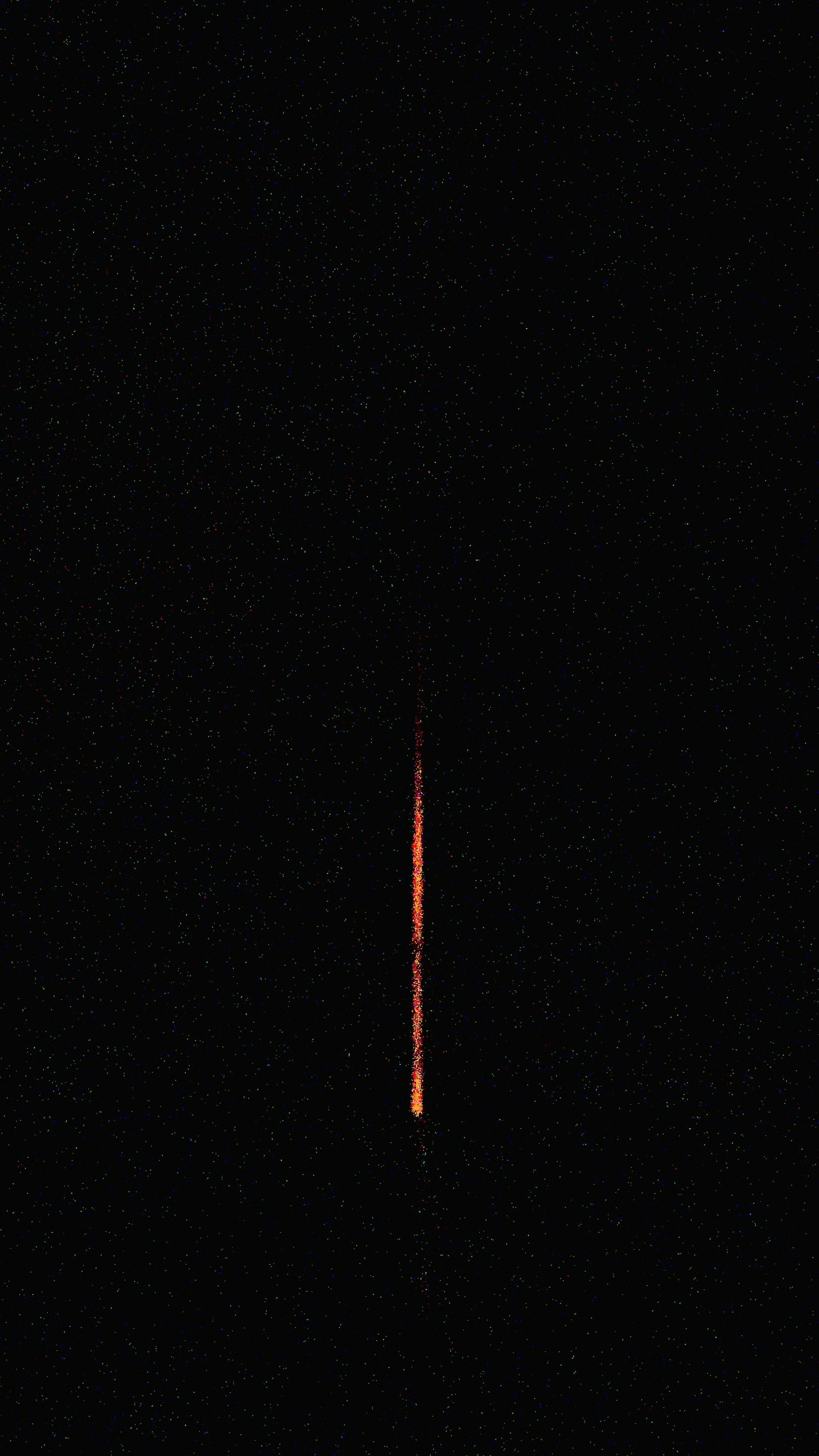 a dark sky with a red line in the middle of it