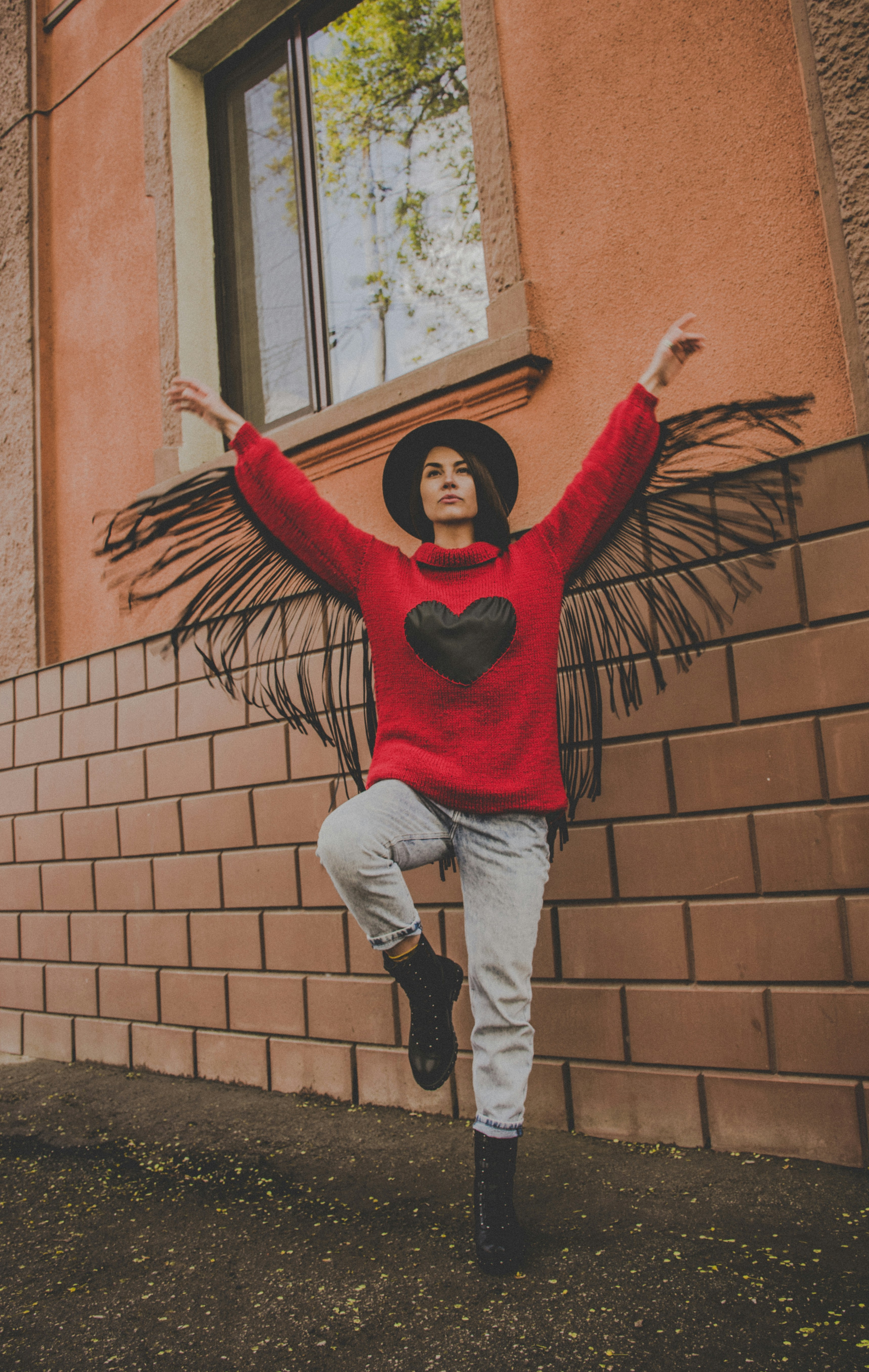 Woman standing beside brown building during daytime photo – Free ...