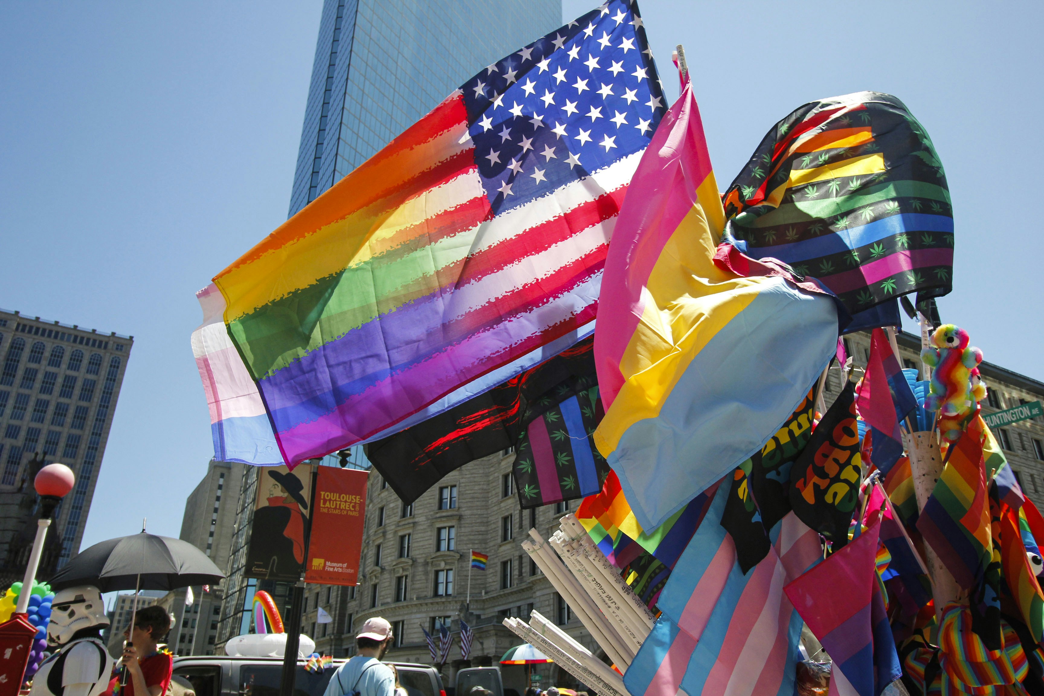Prismatic Flags Over a Bustling City Pride Parade