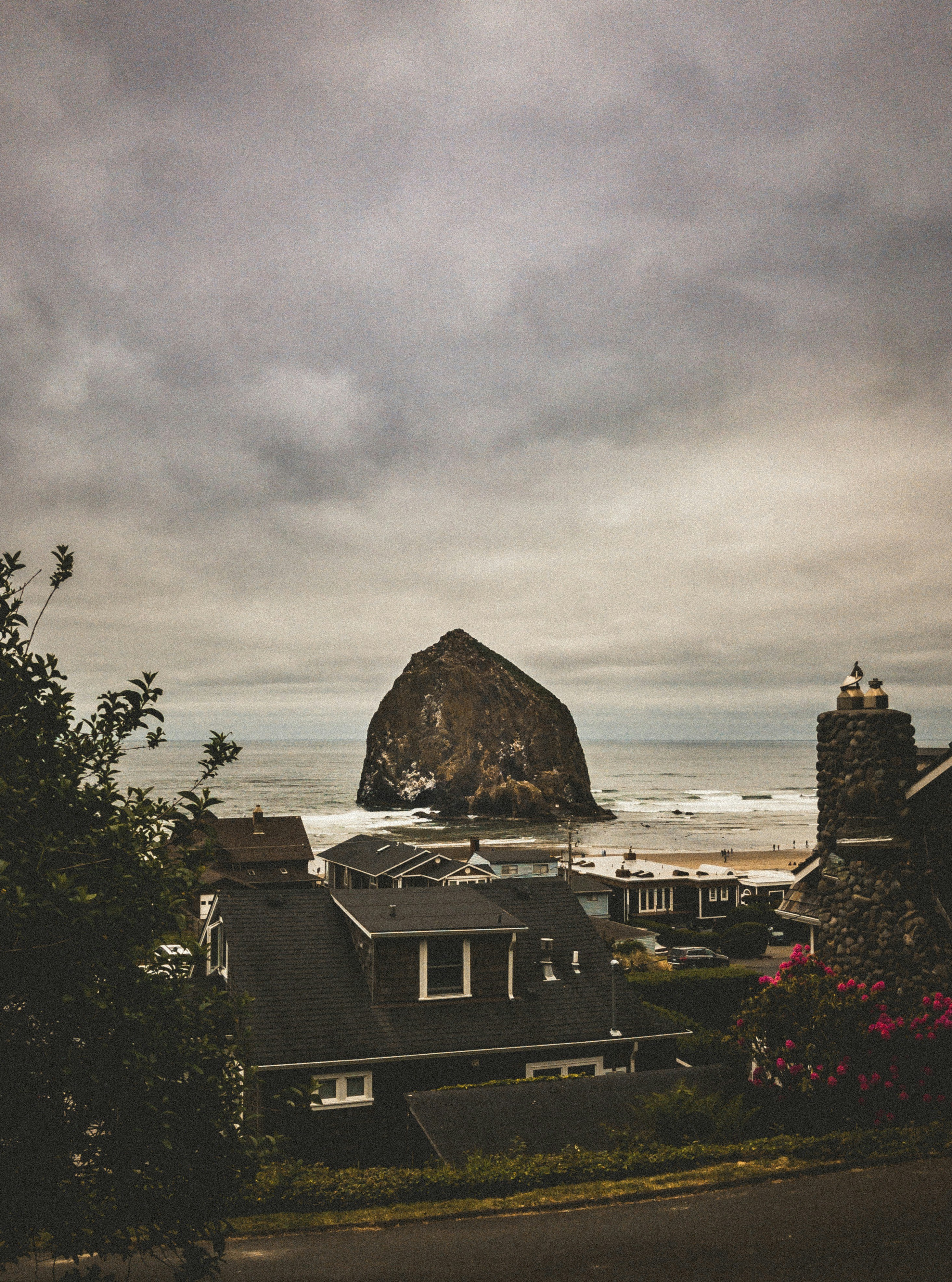 Buildings near ocean under cloudy sky during daytime photo – Free Grey ...