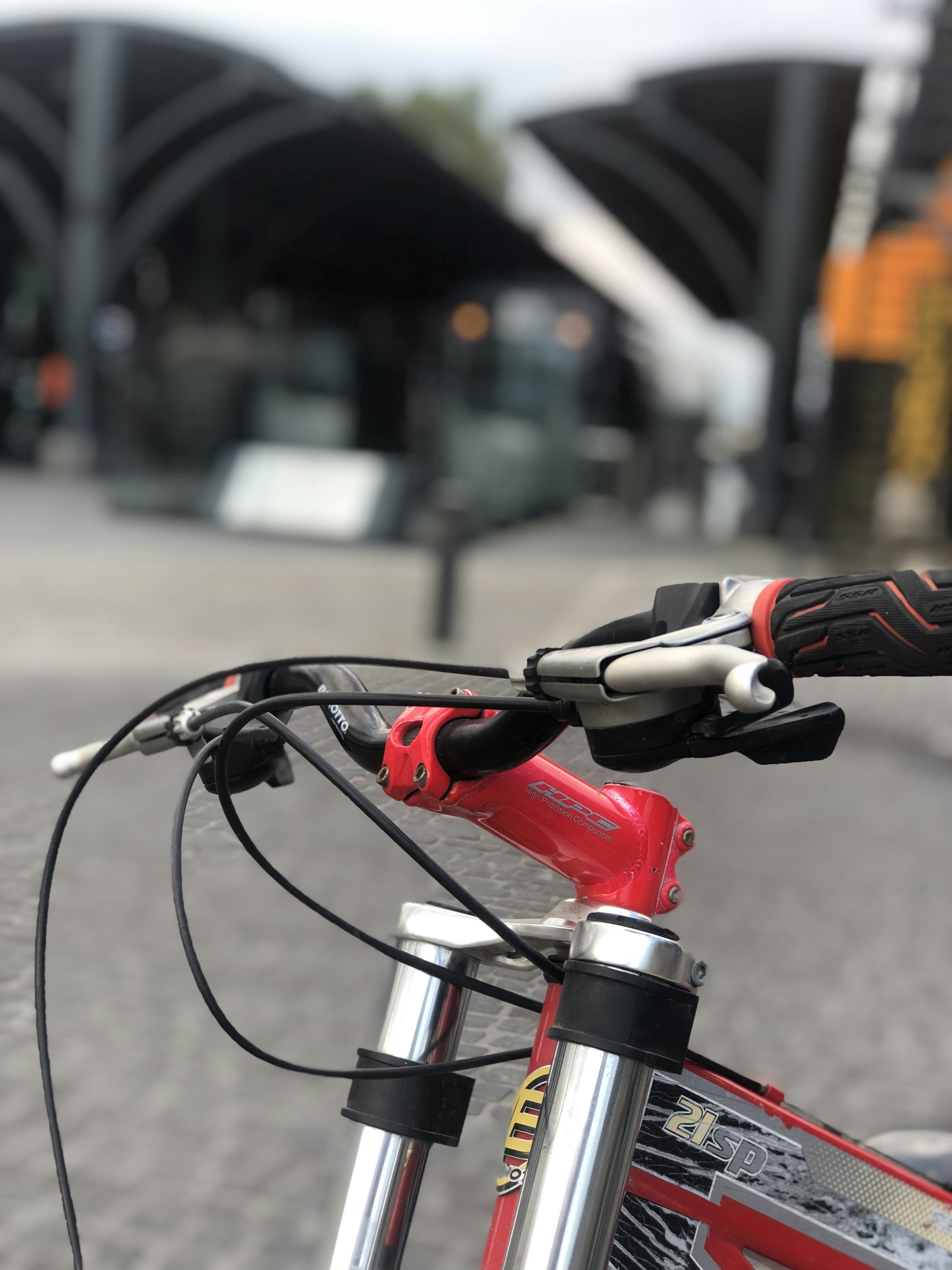 Red Bicycle Front Forks Steady Under Urban Arcade