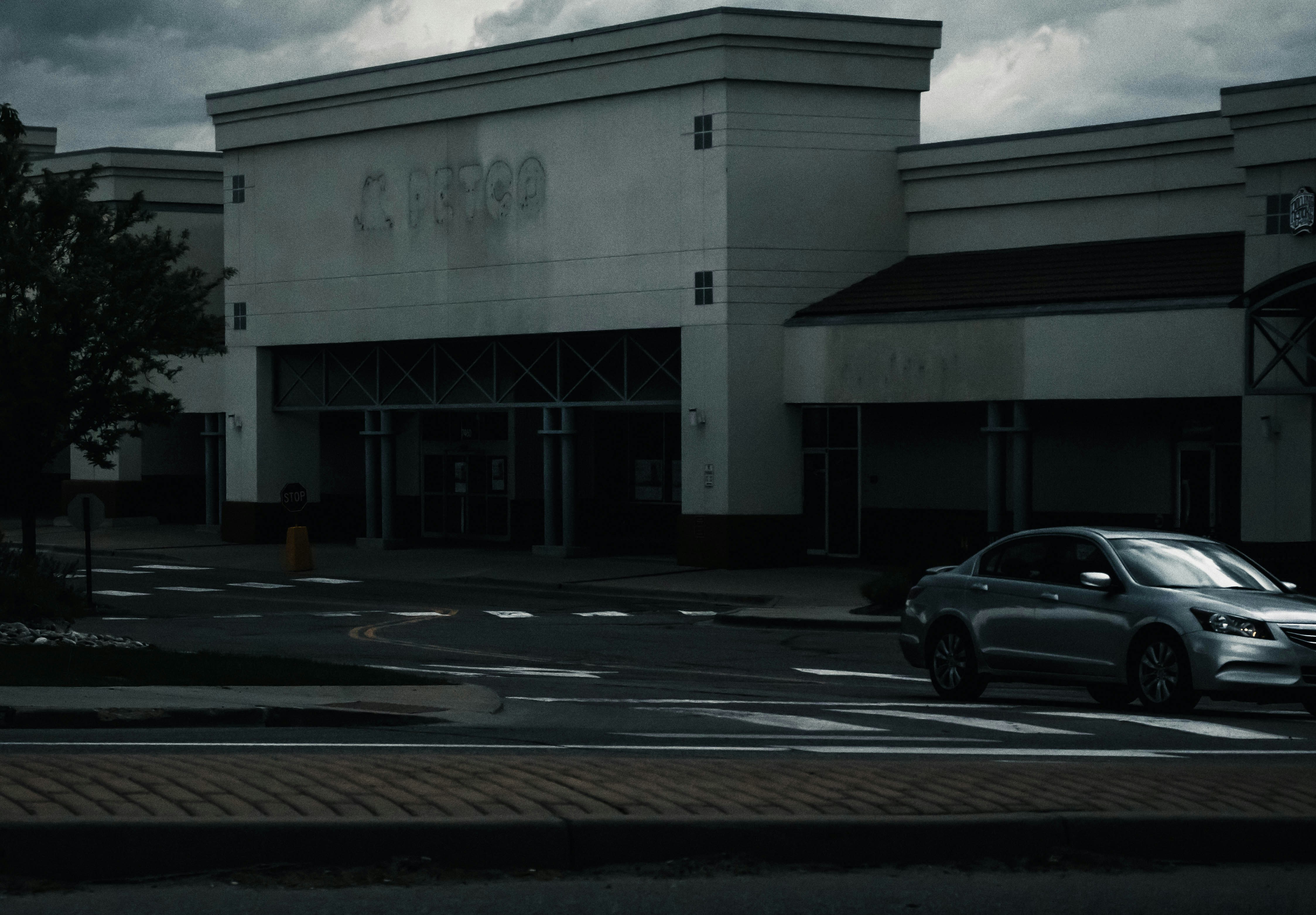 Twilight Parking: A Silent Mall and a Silver Sedan