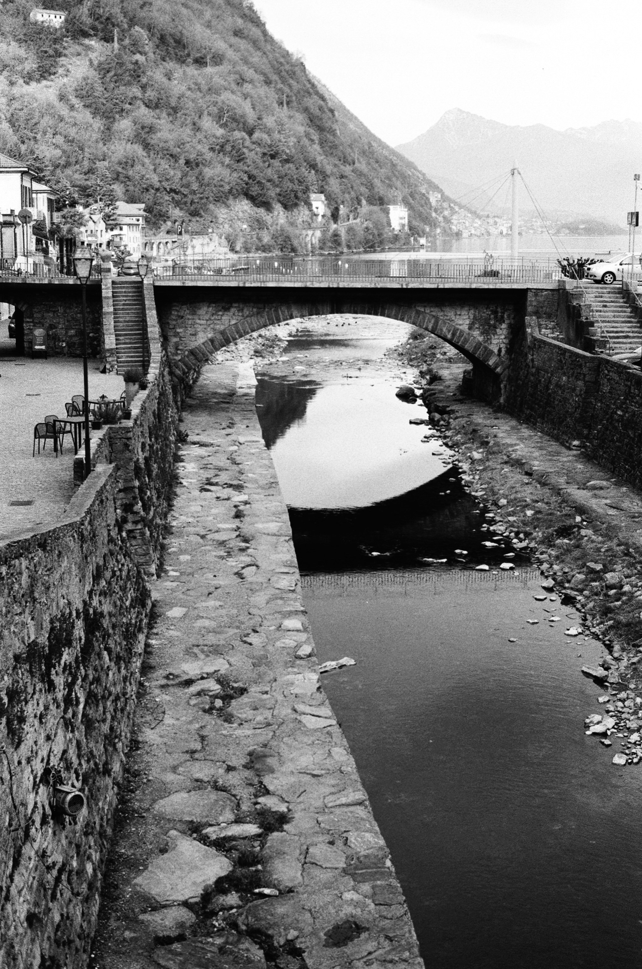 Grayscale photo of river under bridge at daytime photo – Free Water ...