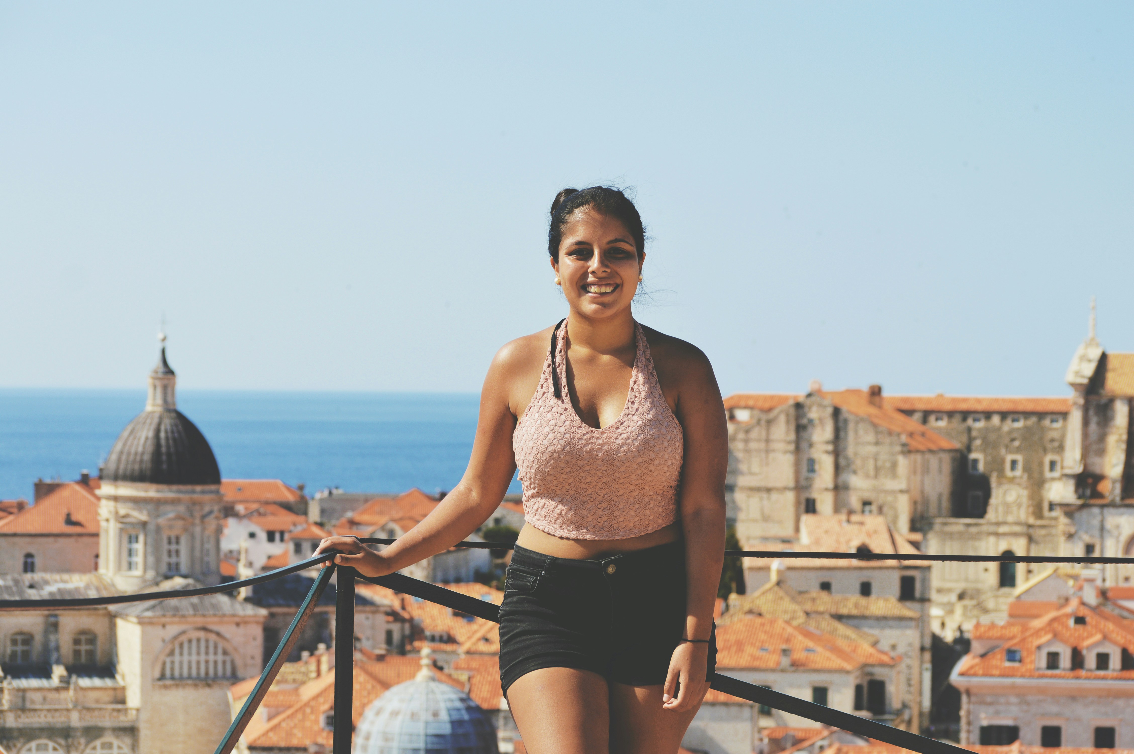Terracotta Rooftop Portrait Over a Mediterranean Harbor