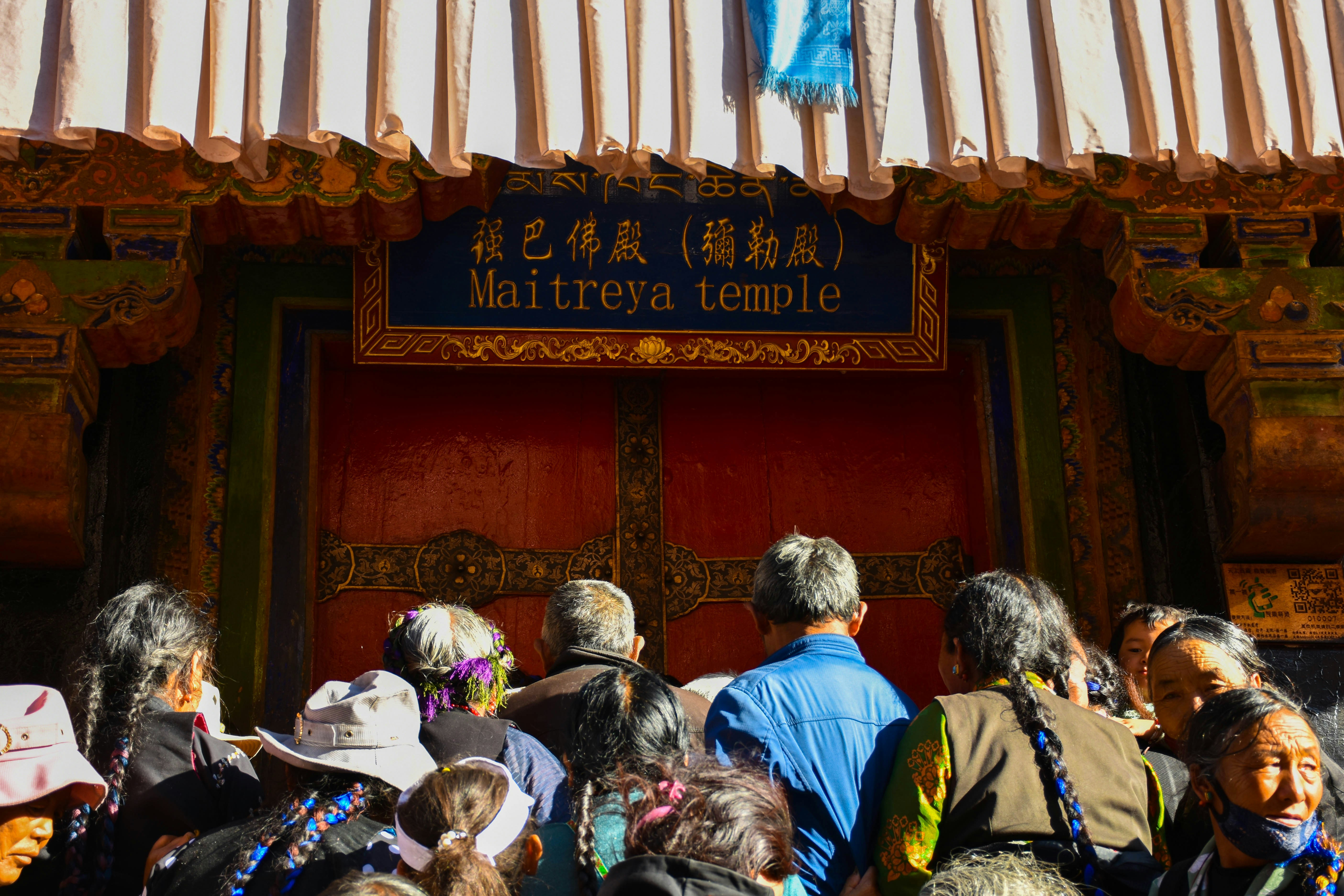 People gathering on front of Maitreya temple sign photo – Free China ...