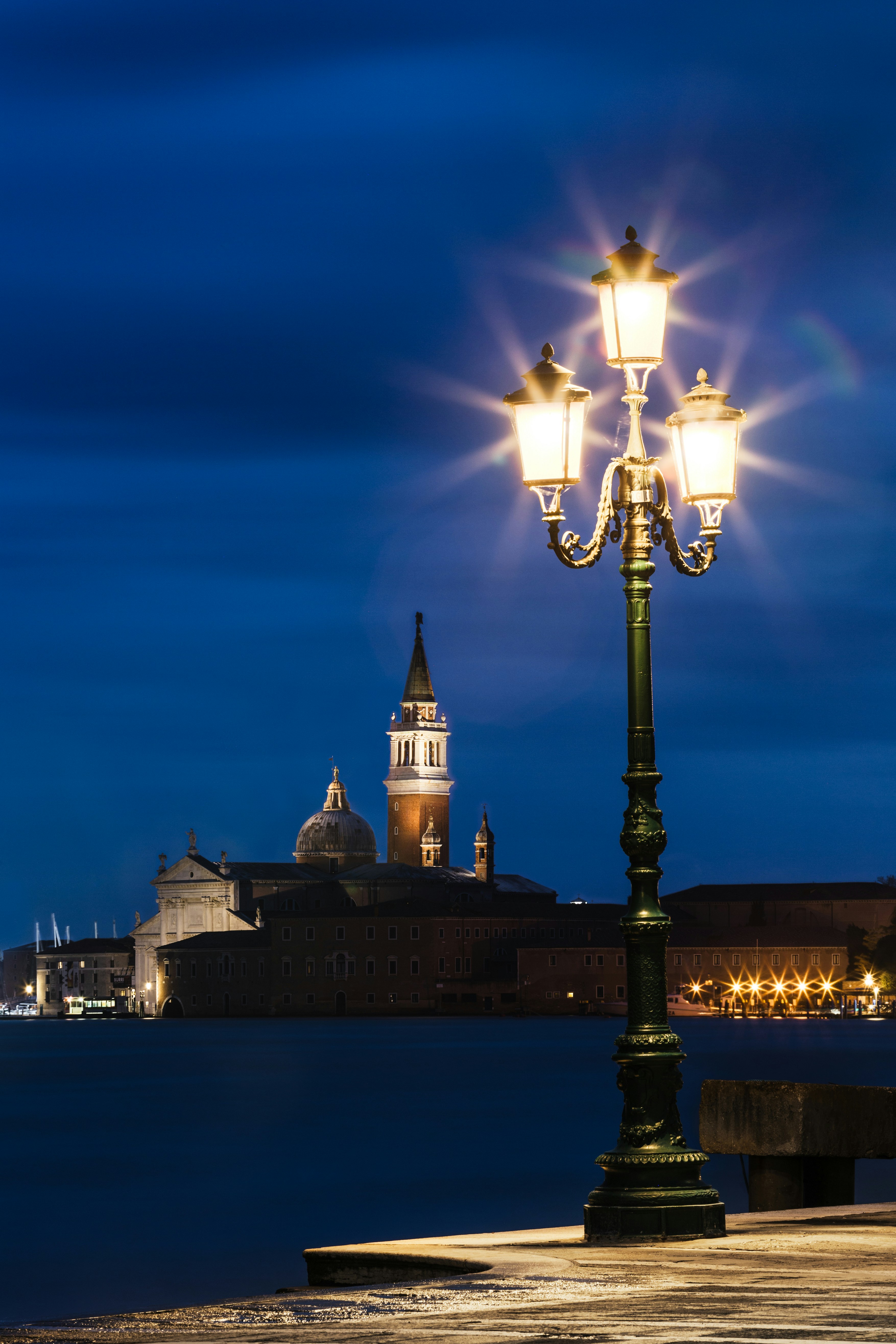 Luminous Beacon over Venetian Waters at Dusk