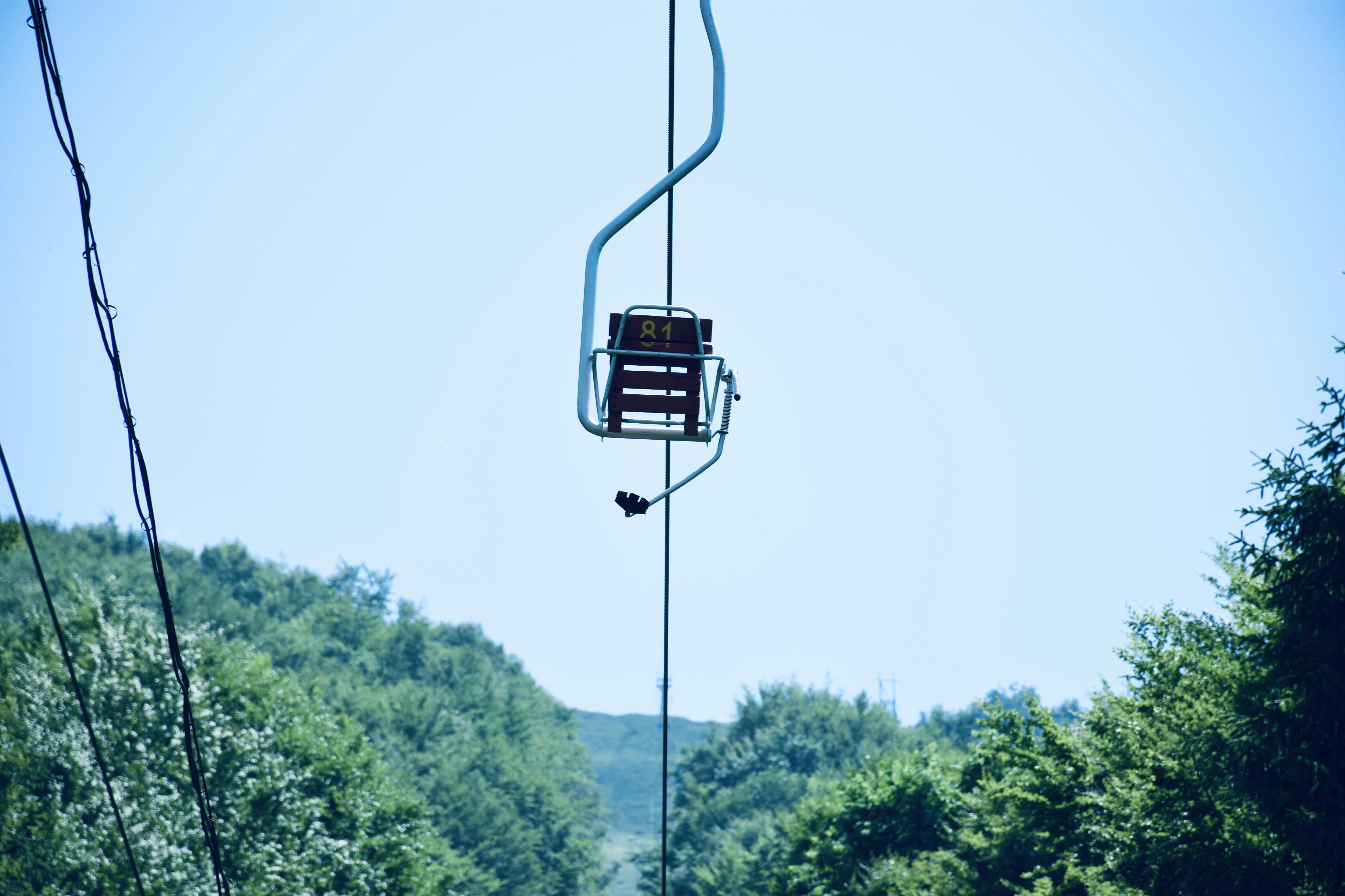 High Limechair Lift Ascending Above Verdant Valley