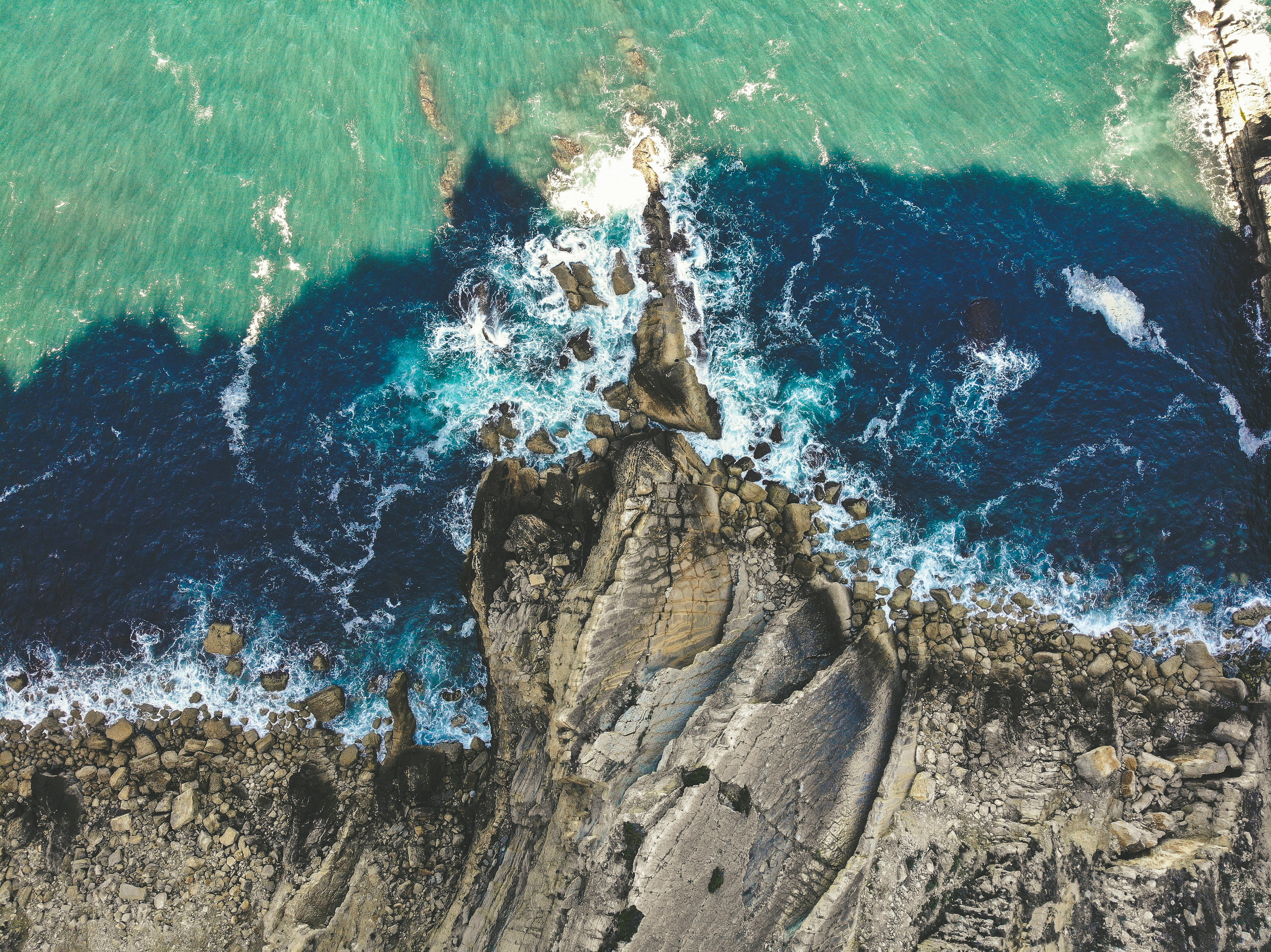 Aerial photography of ocean waves crushed on rocks photo – Free Lisbon ...