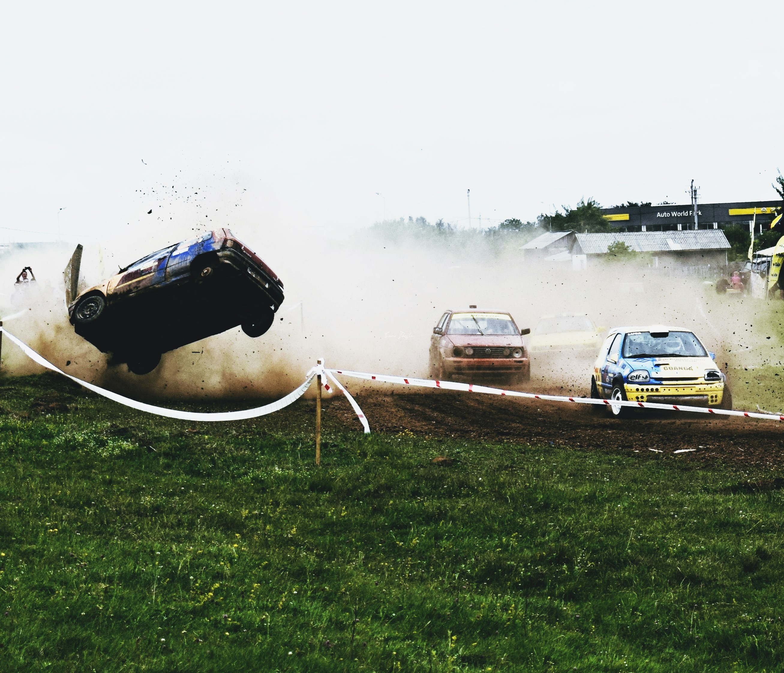 Dustbound Leap: The Blue Rally Car Jets Off the Dirt Jump