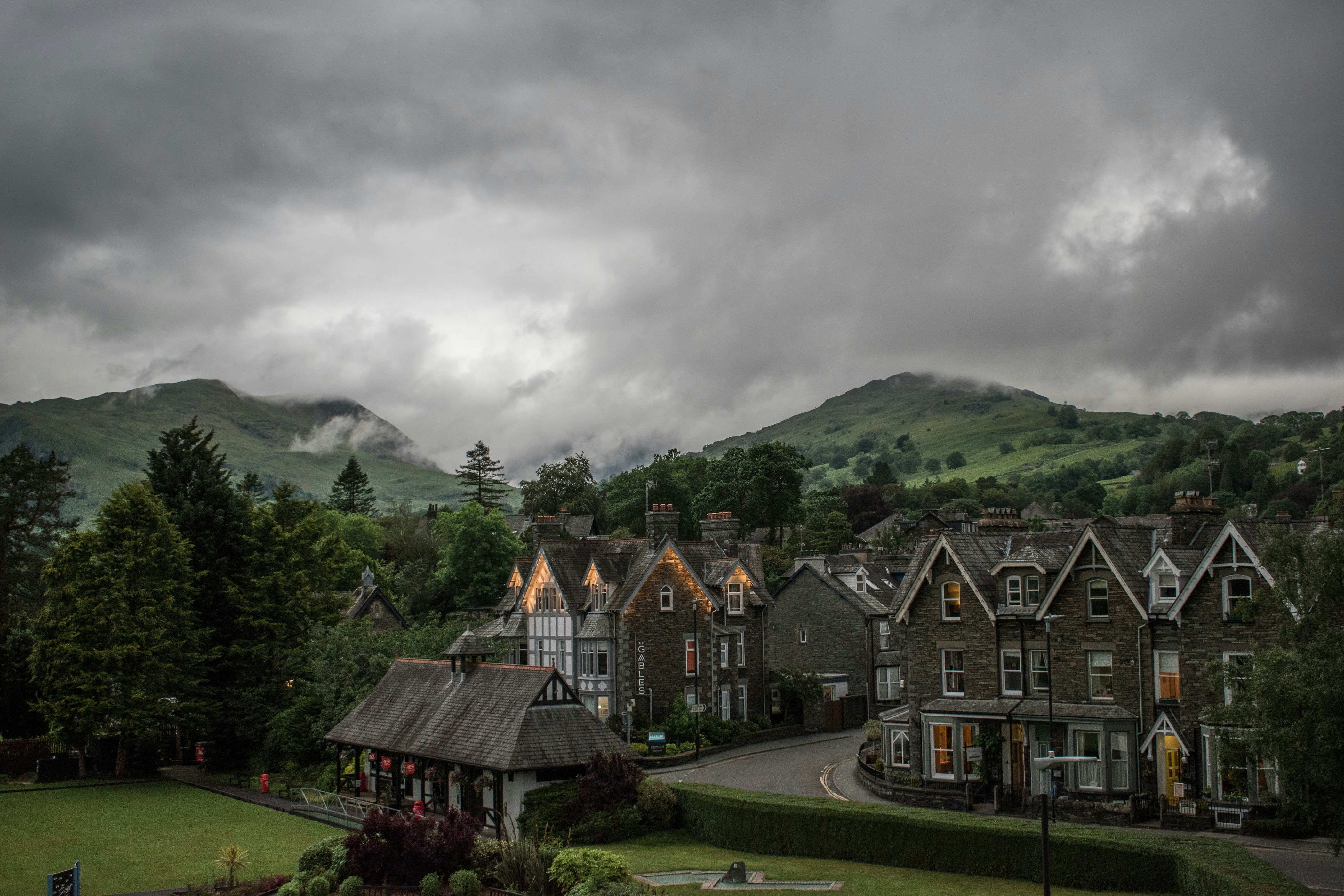 A view of a gorgeous little town called Ambleside in the Lake District National Park in the UK. | aerial photography of brown house