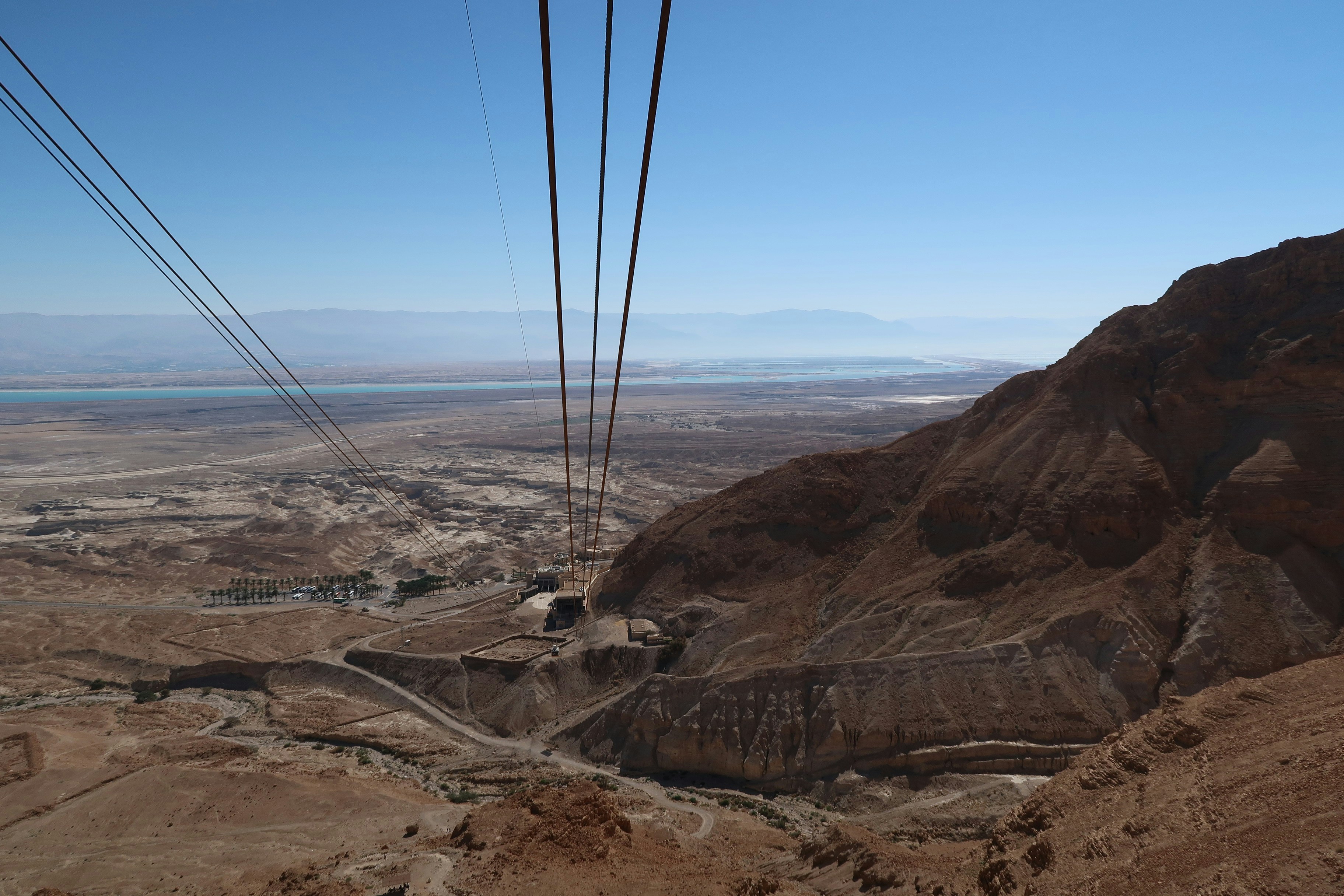 Desert Ascent: An Aerial Tram Winding Across a Parched Valley