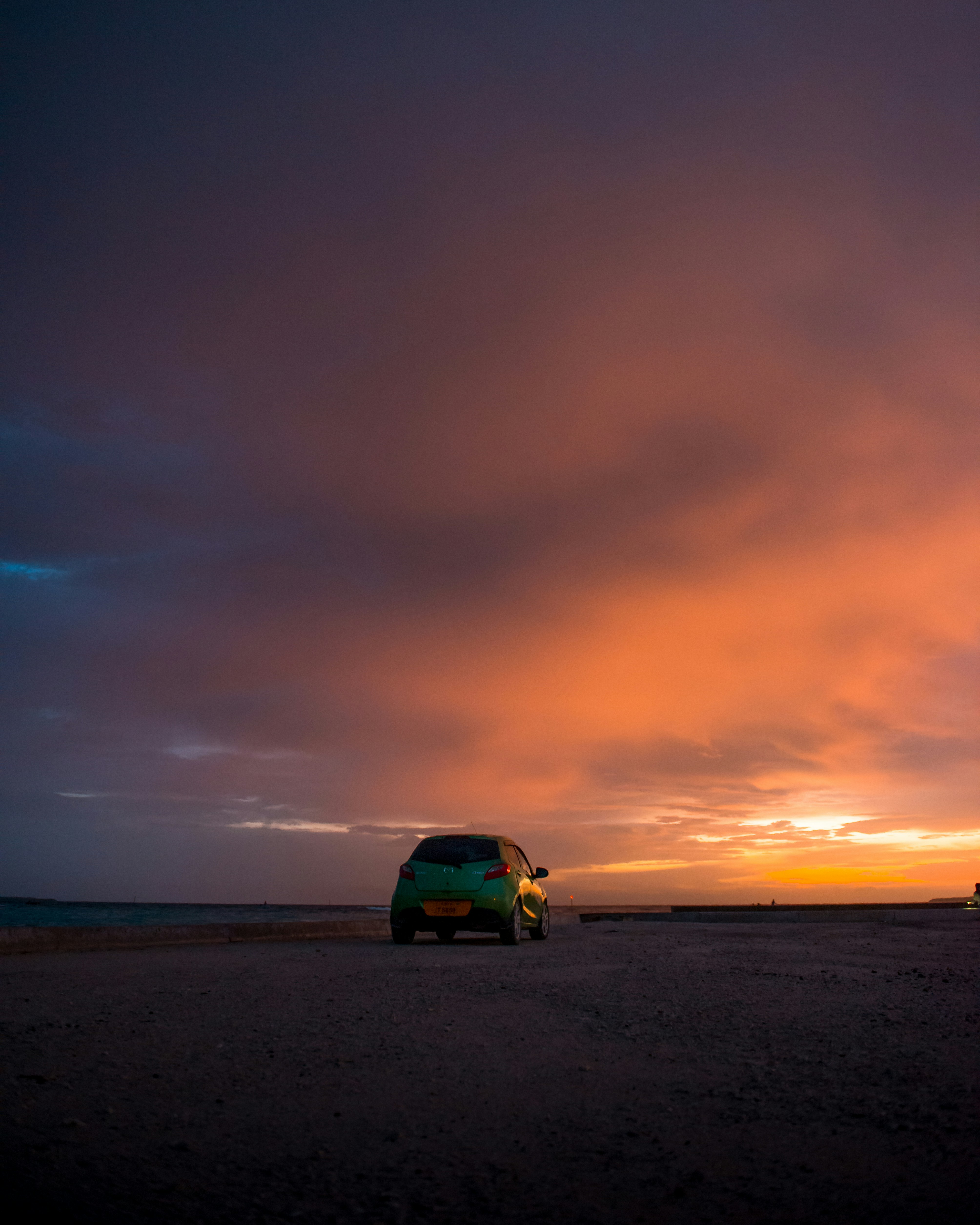 Eco-Car at Sunset: A Quiet Drive Along the Shore
