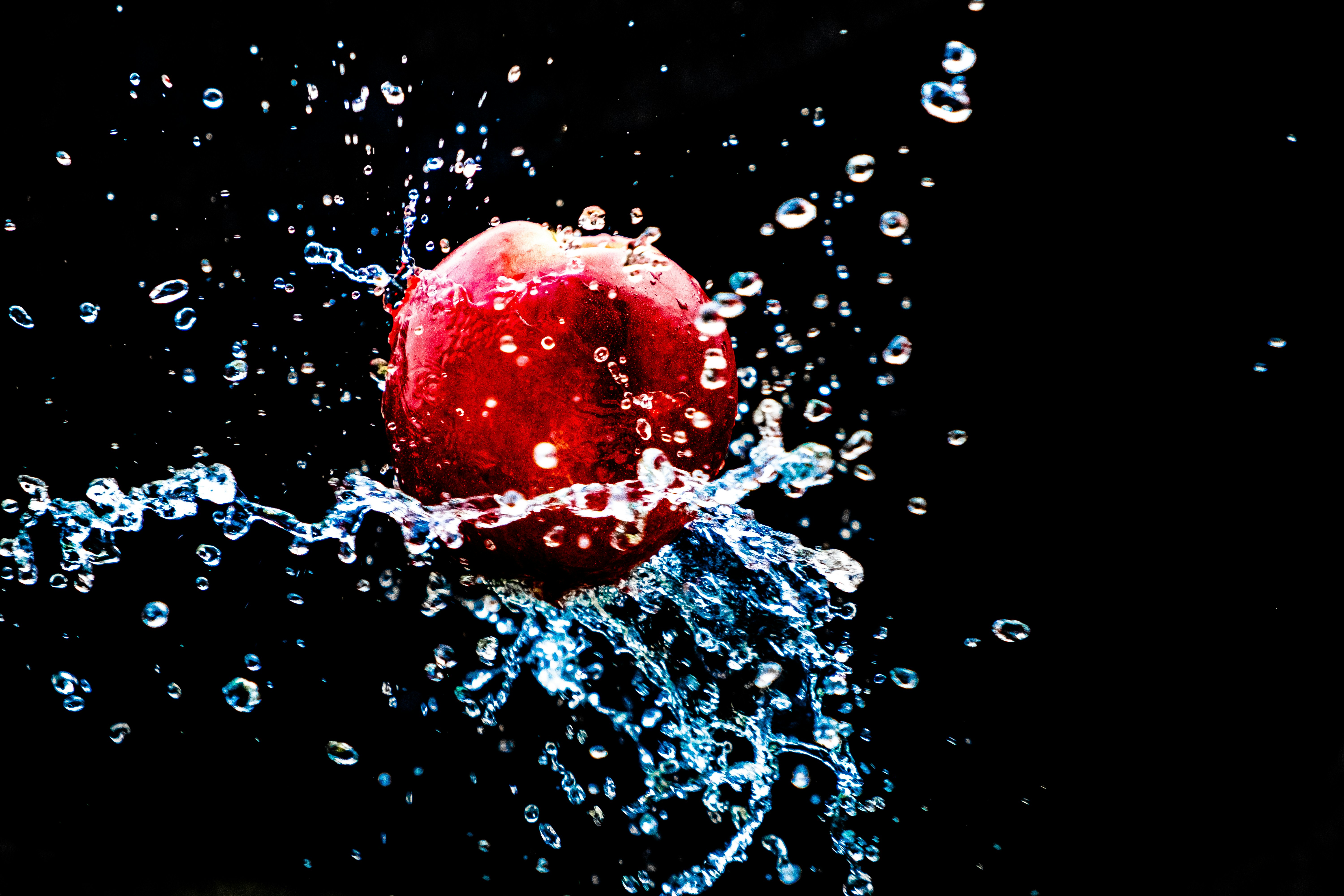 Crimson Apple Pierced by Sparkling Splash