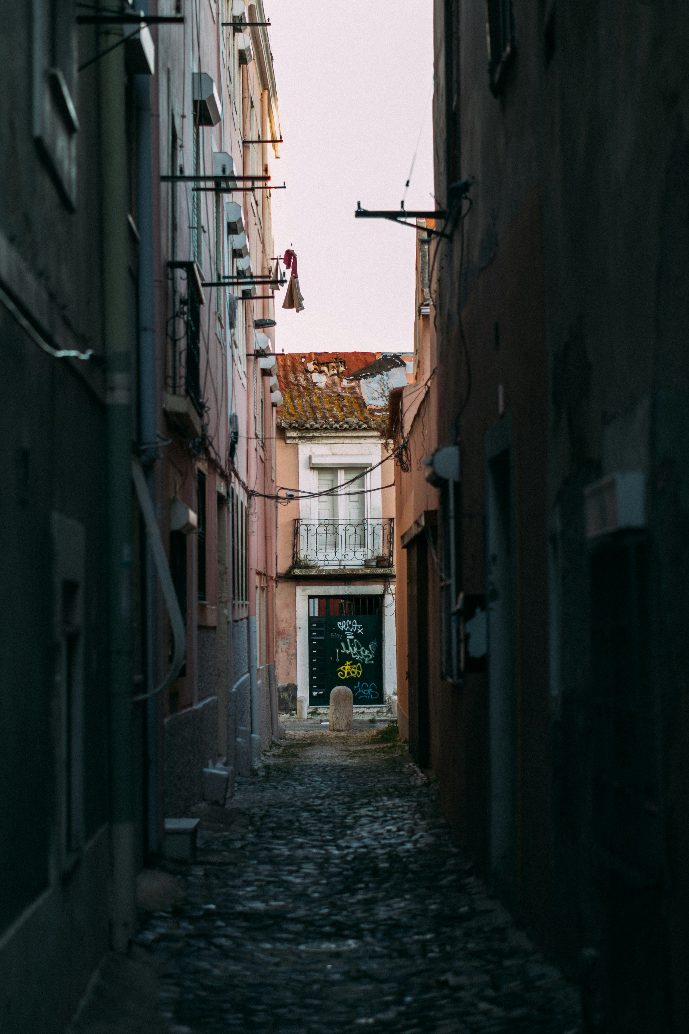 Alley photography of walkway between building during daytime photo ...