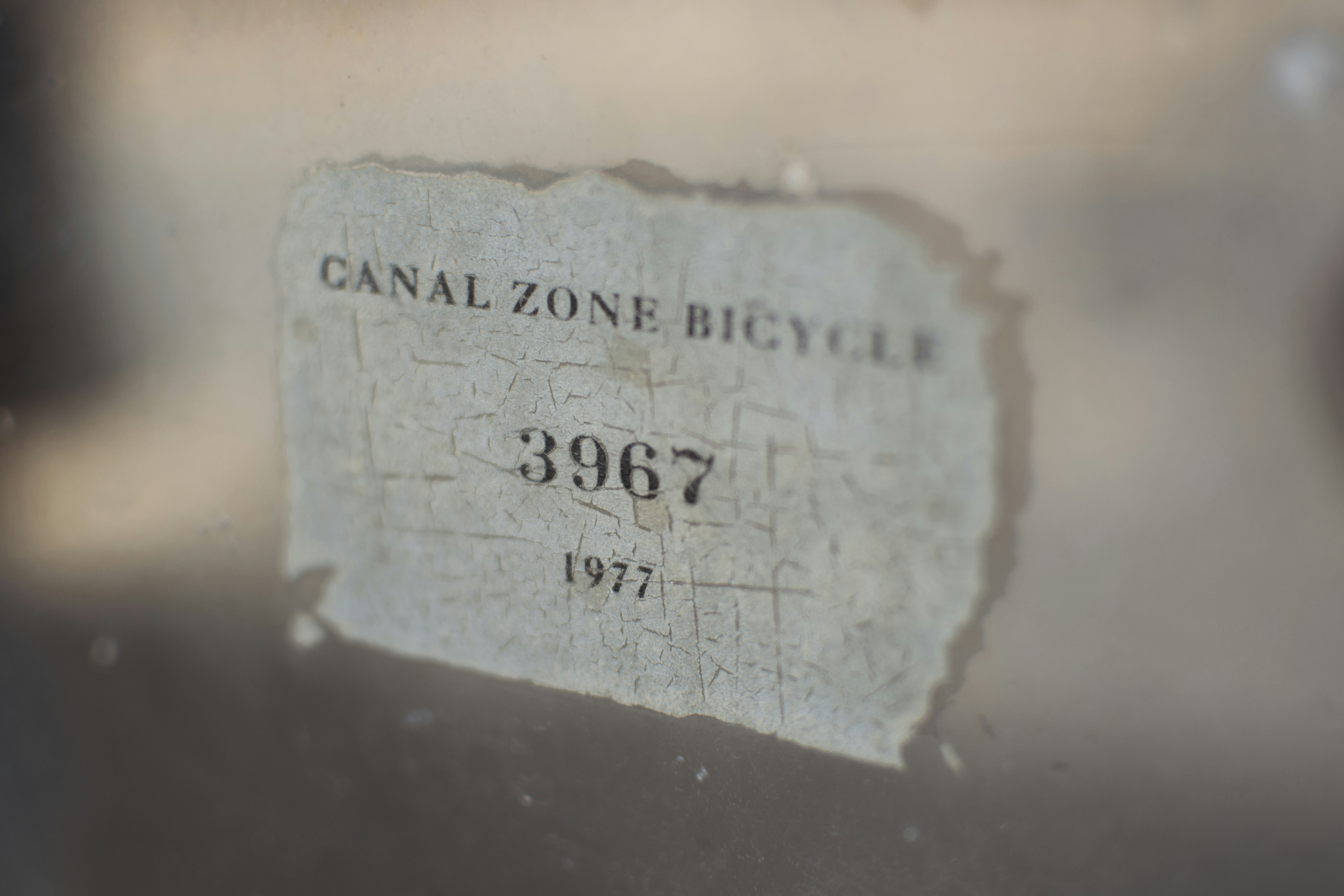 Cracked Canal Zone Bicycle Tag: 3967, 1977