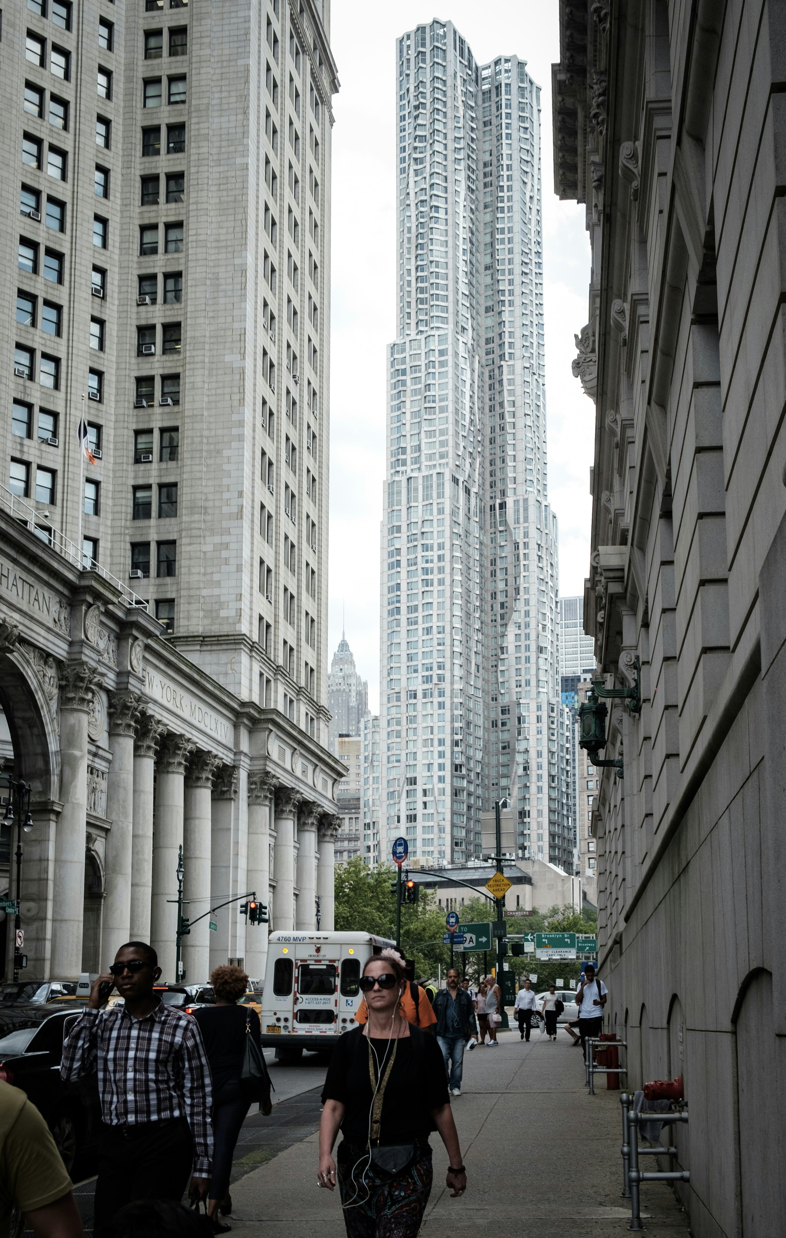Skyline Between Columns: Street Level View of Glass Giants