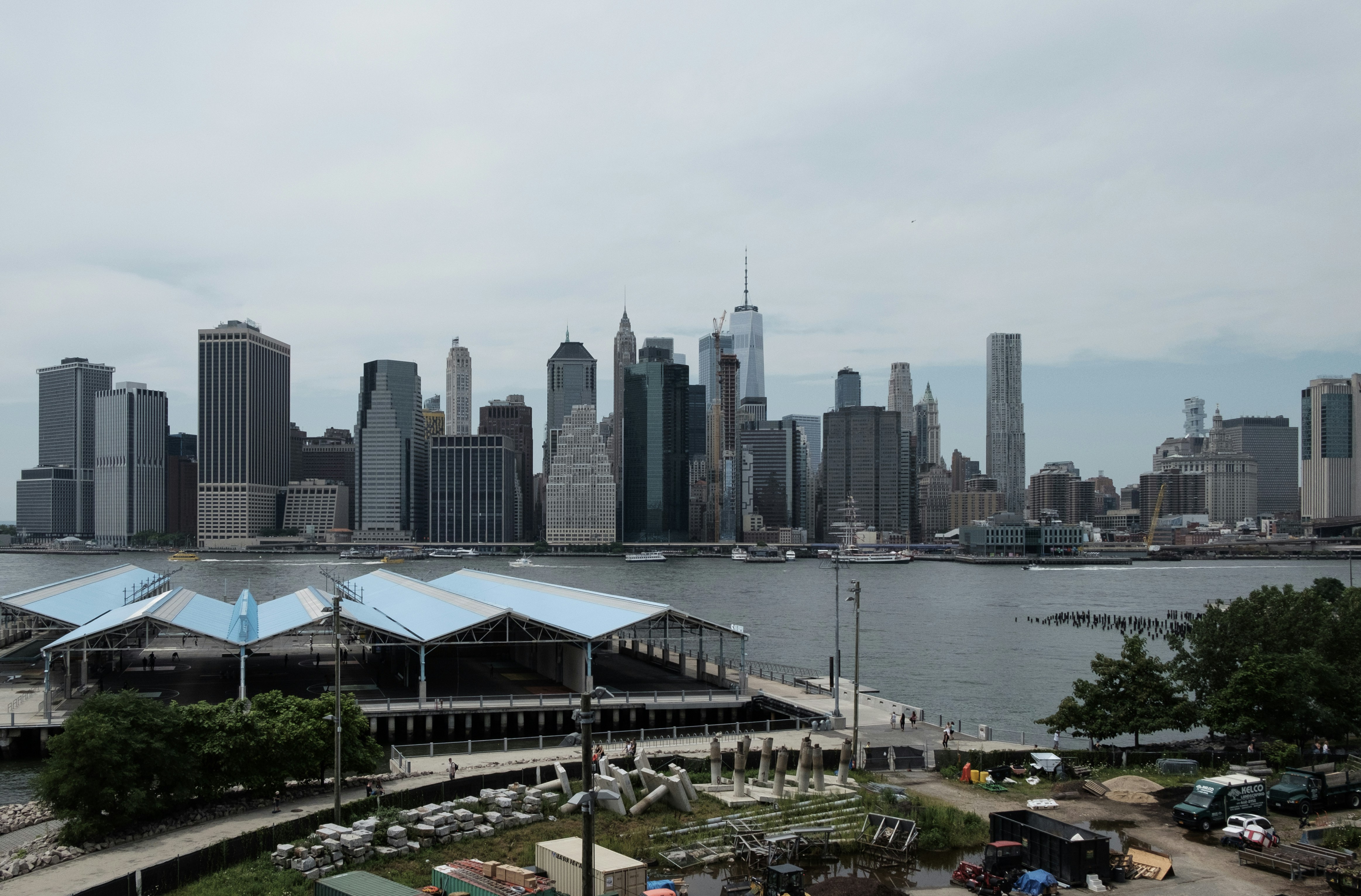 Blue Roofs Framing a Harborfront Skyline