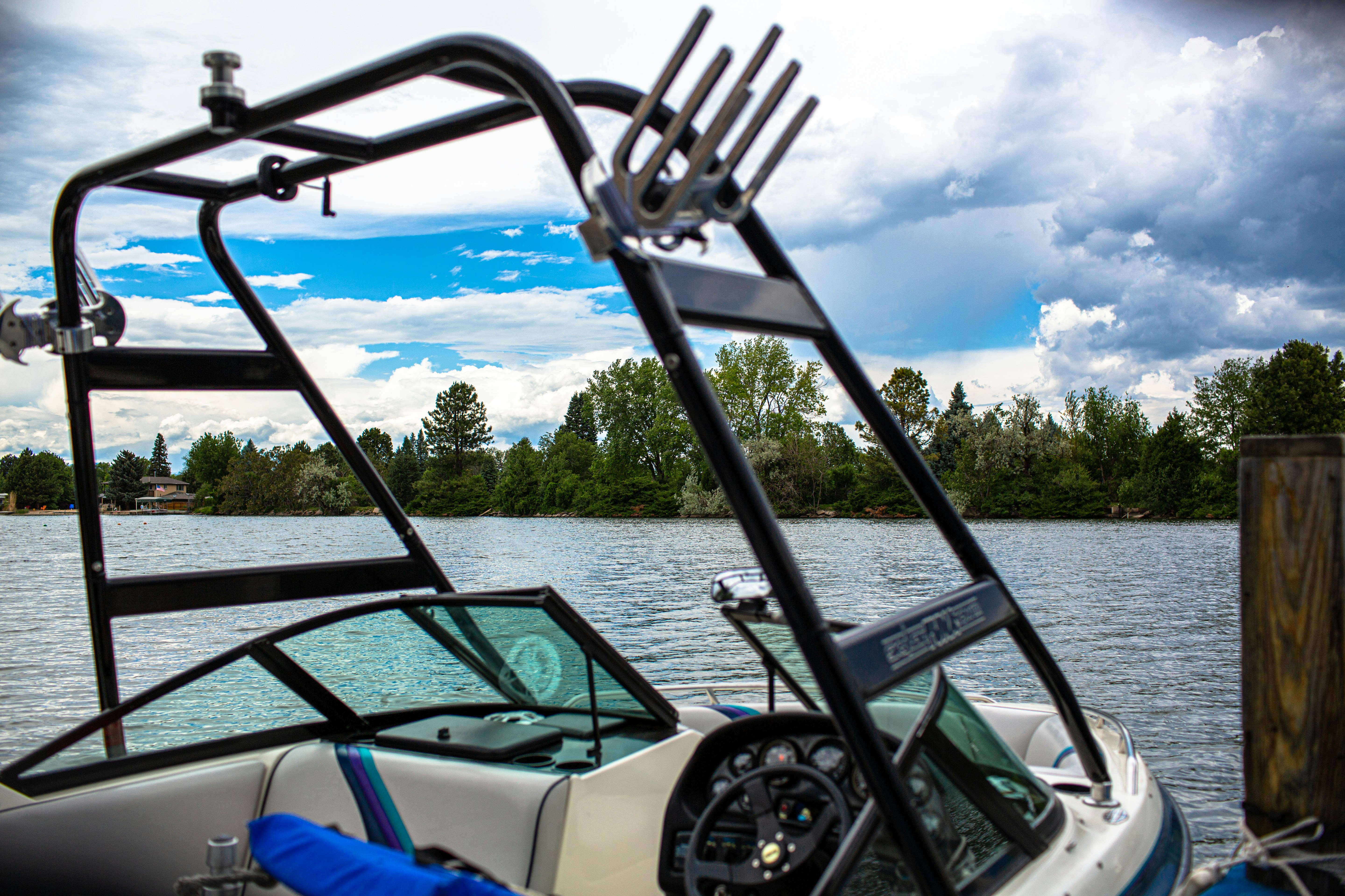 Bowside Portrait: A Wakeboard Boat at Dappled Lake Light