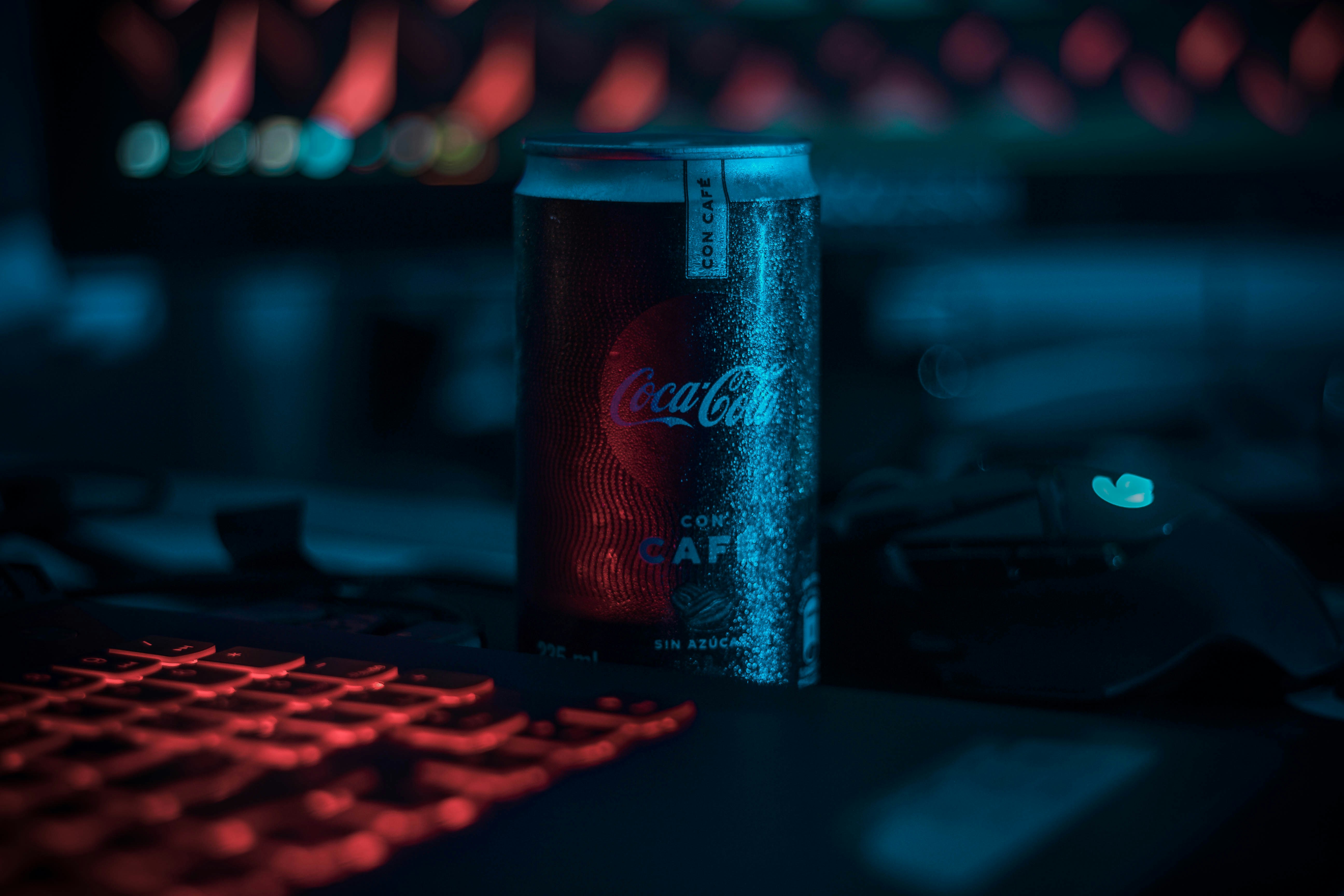 Coca-Cola soda can beside mechanic keyboard photo – Free Work space ...