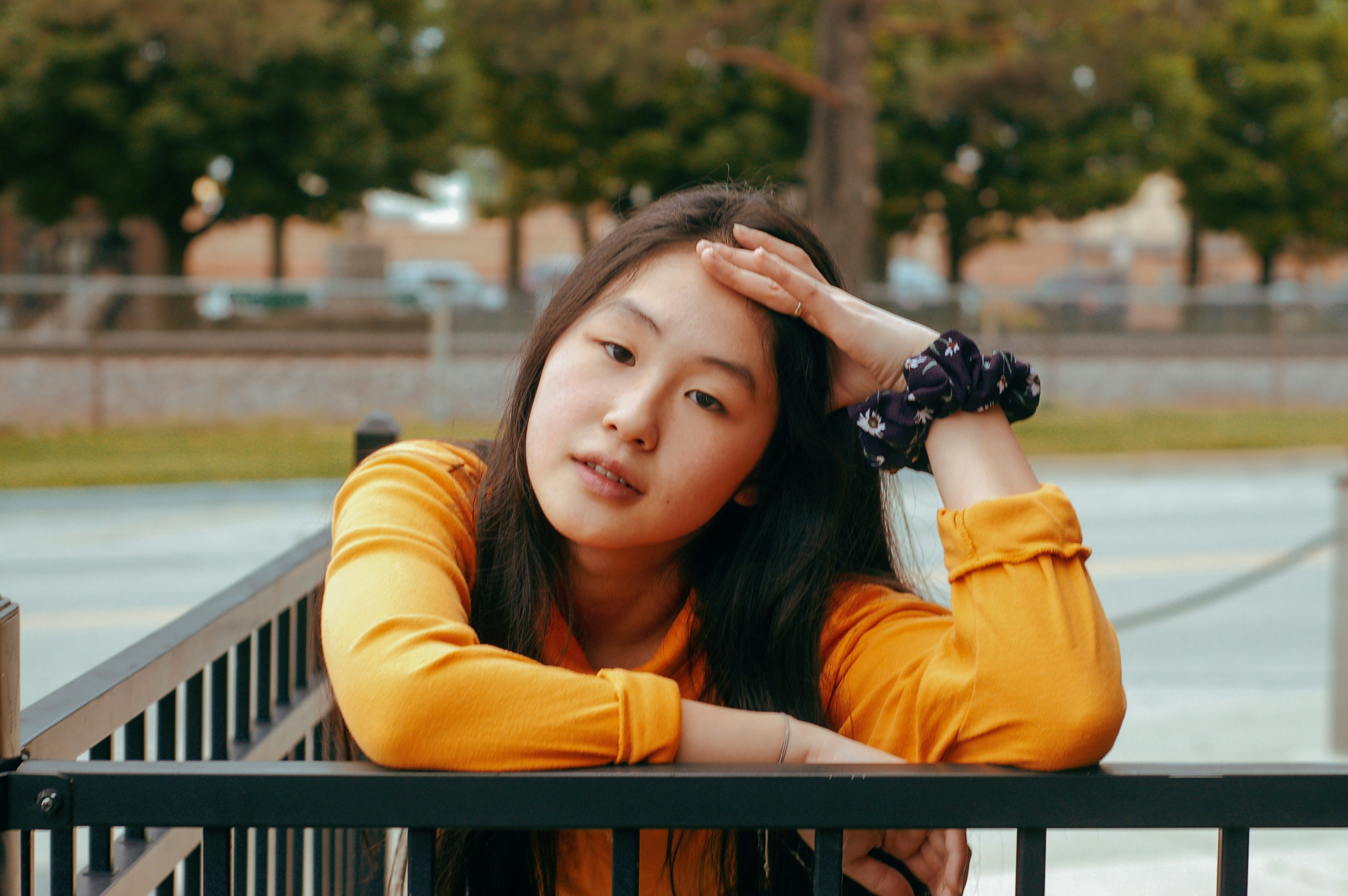 Woman leaning on black railings photo – Free Human Image on Unsplash