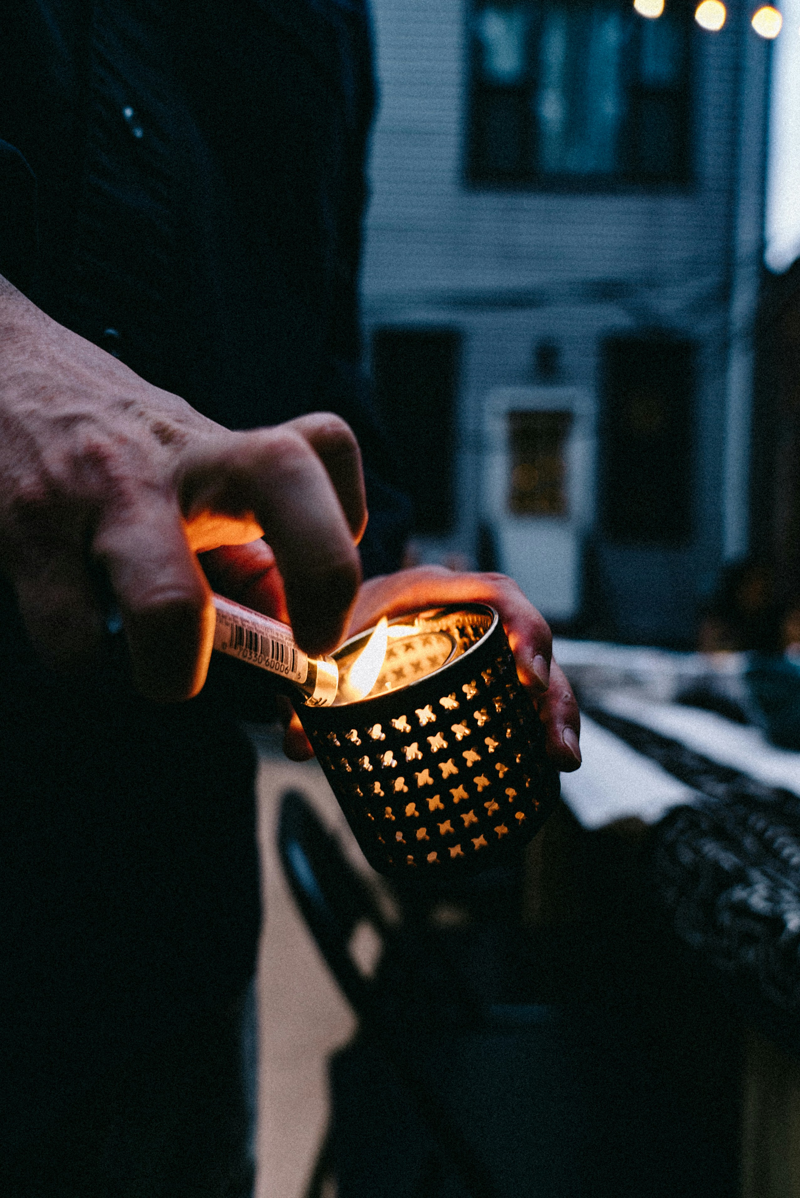 person holding orange lighter