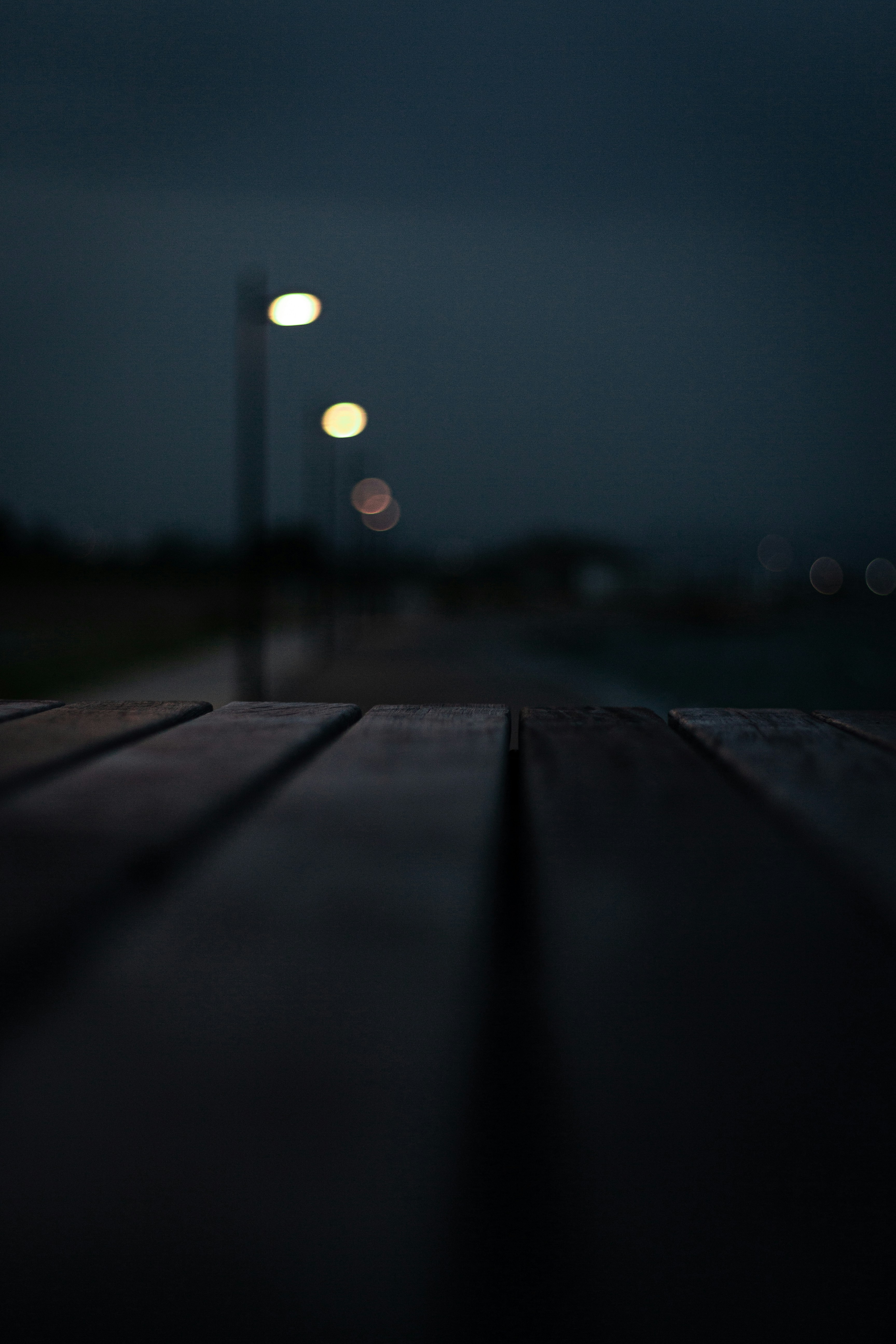 Dim Pierlights: Velvet Night Over Weathered Wood