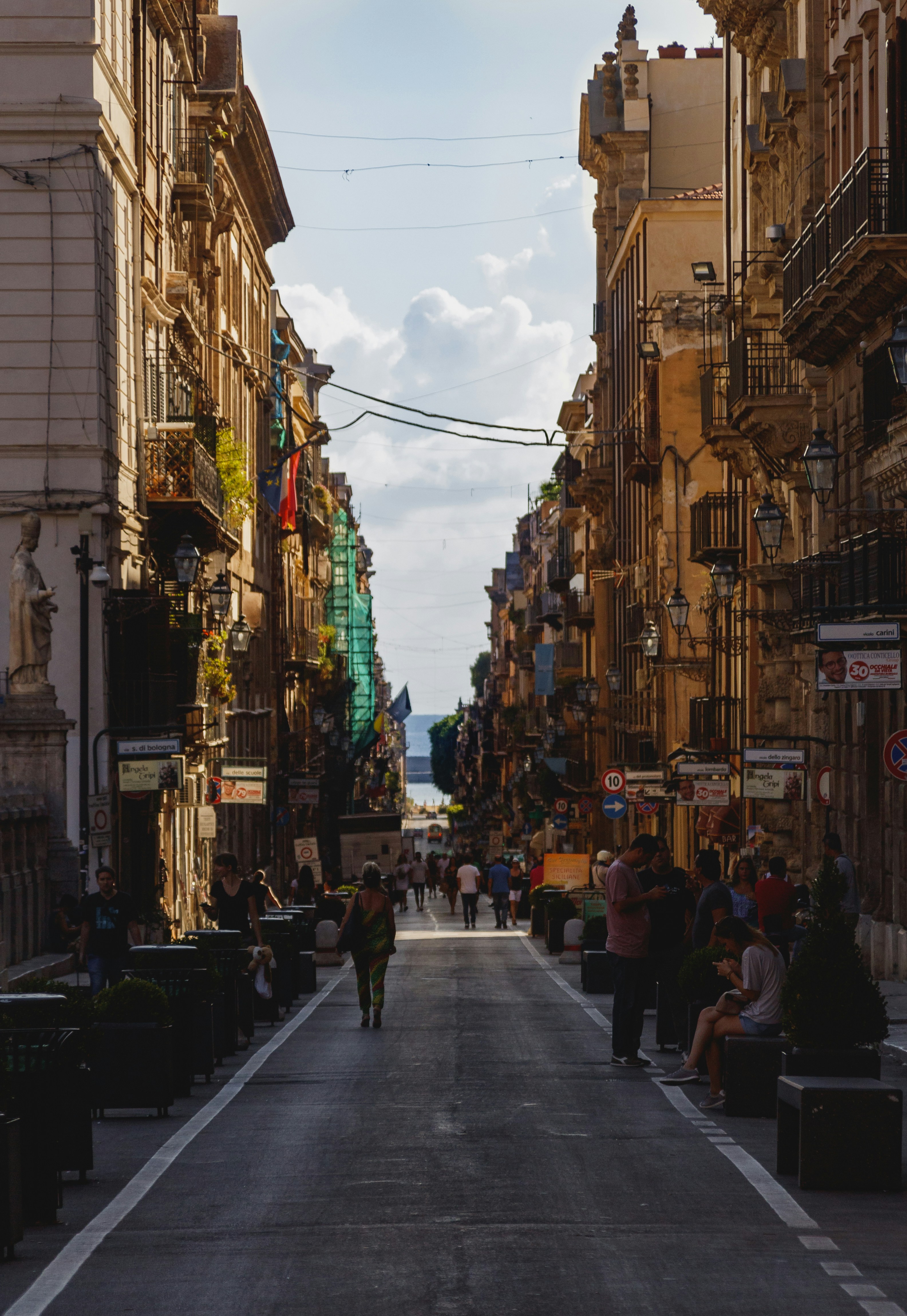 Lantern-Lined Street Reaching Toward a Distant Sea