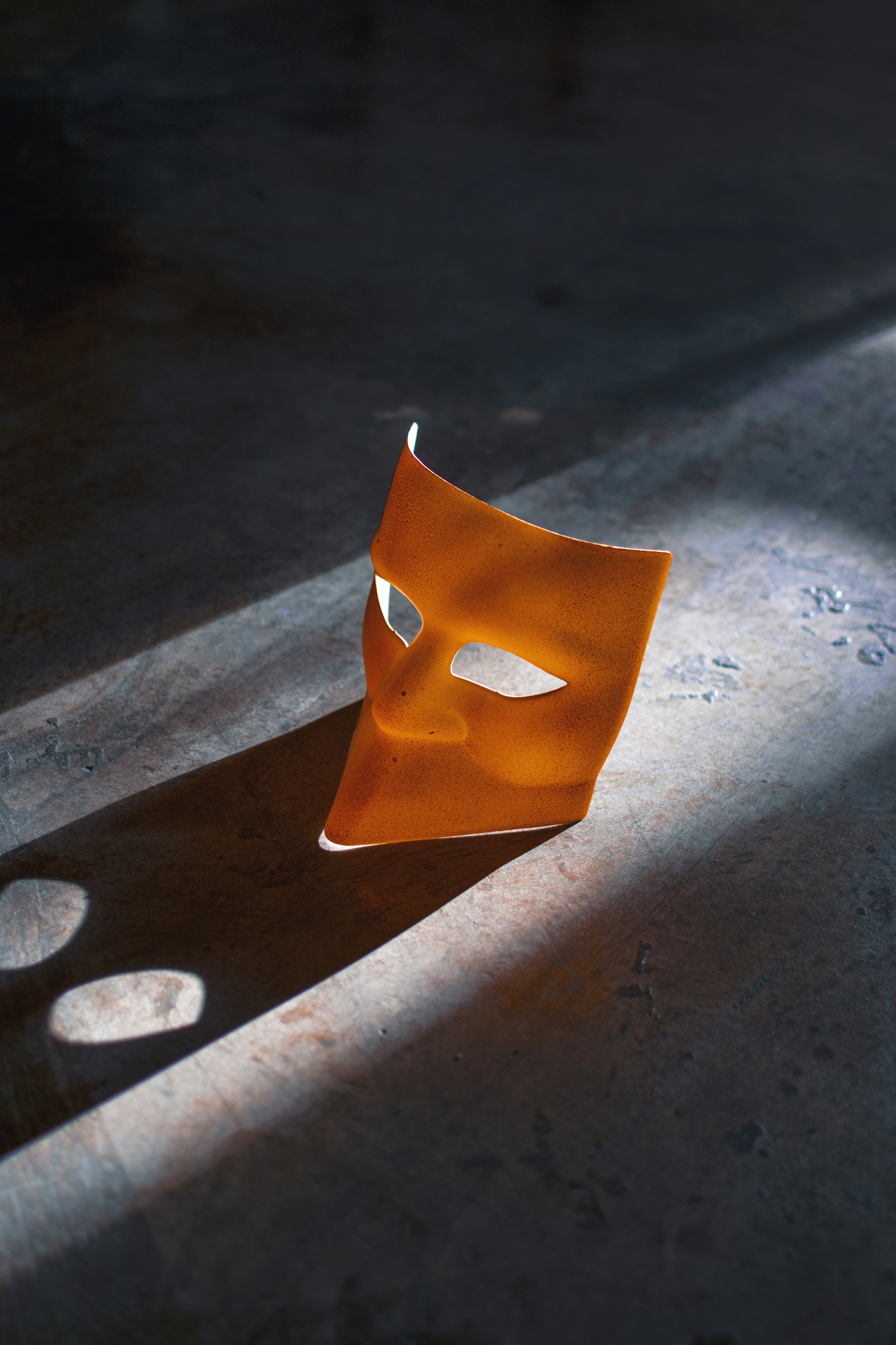 Mask in a Narrow Beam: Orange Shape on Concrete