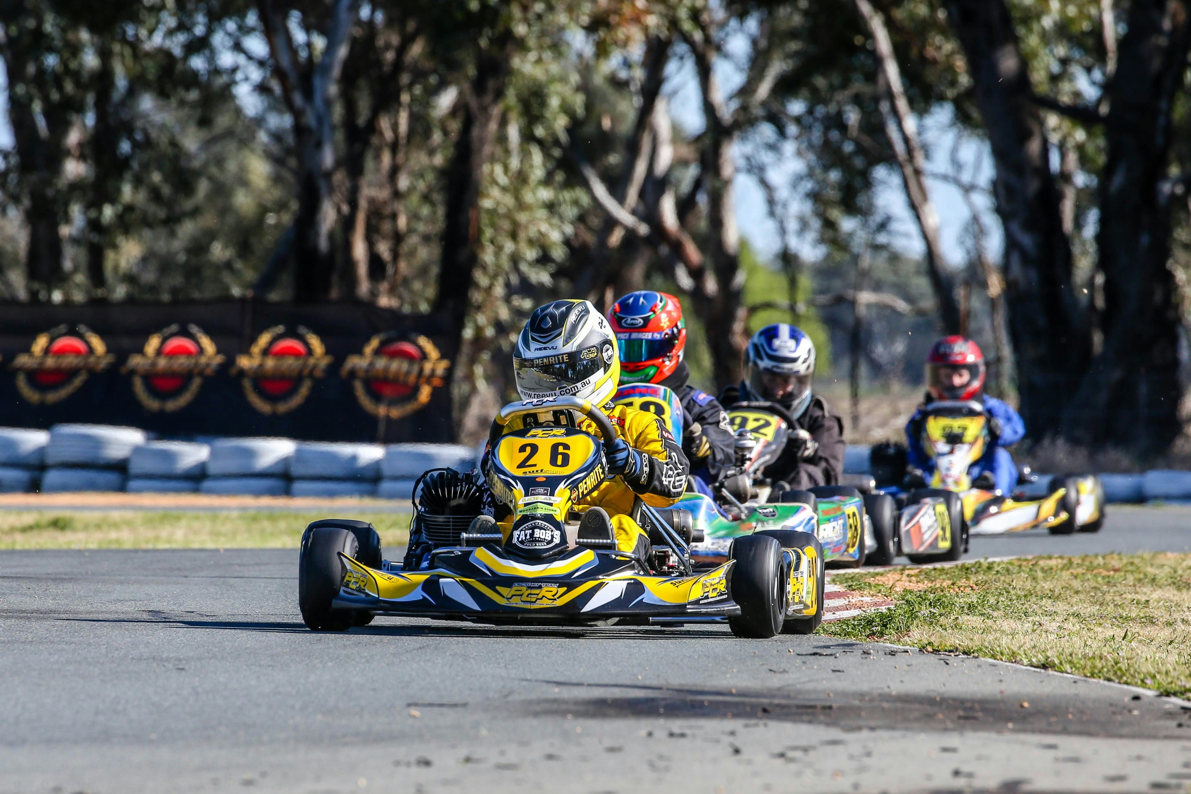 Four race carts in assorted colors photo – Free Helmet Image on Unsplash