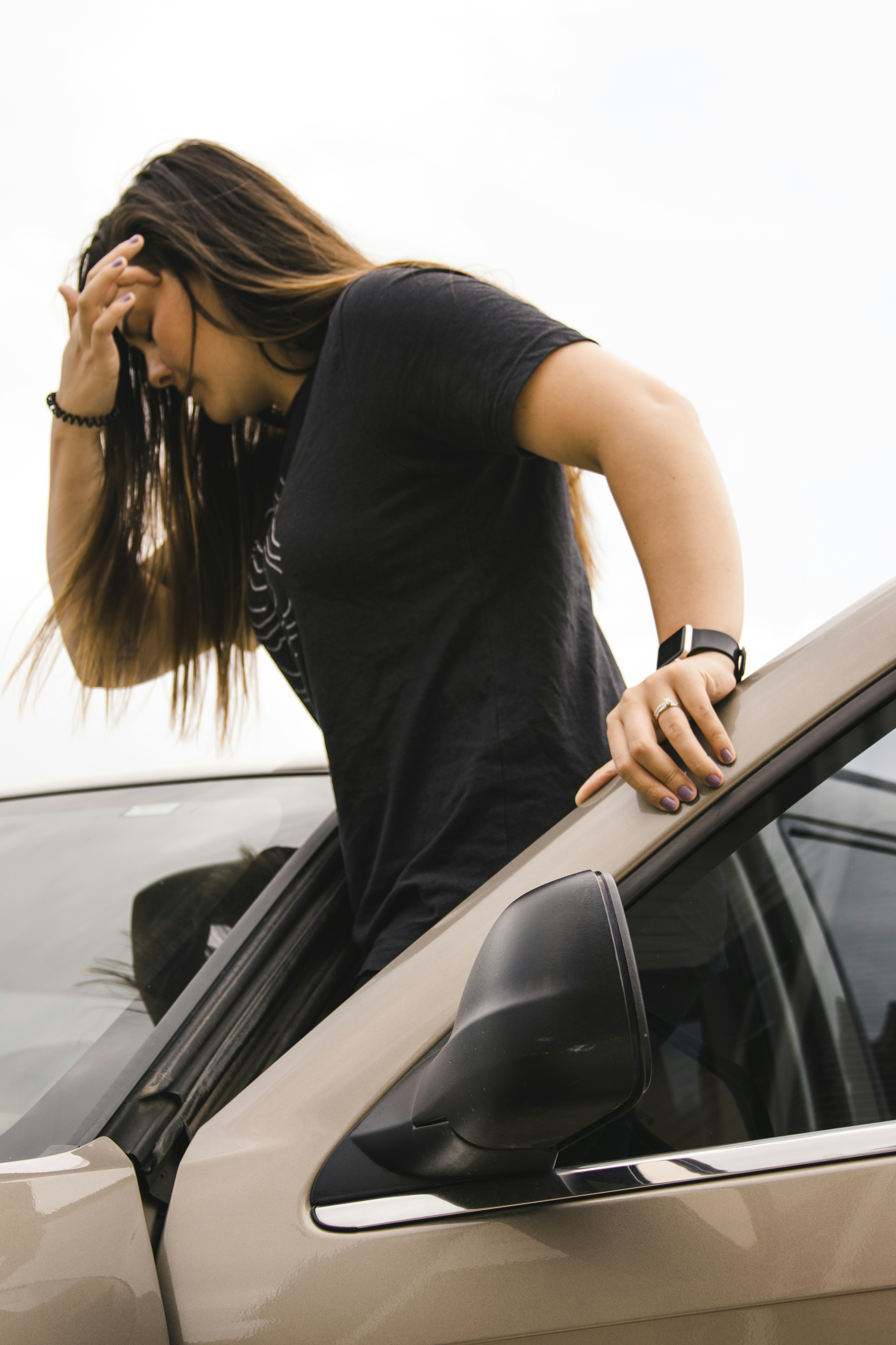 Leaning Into the Quiet: A Moment at the Car's Threshold