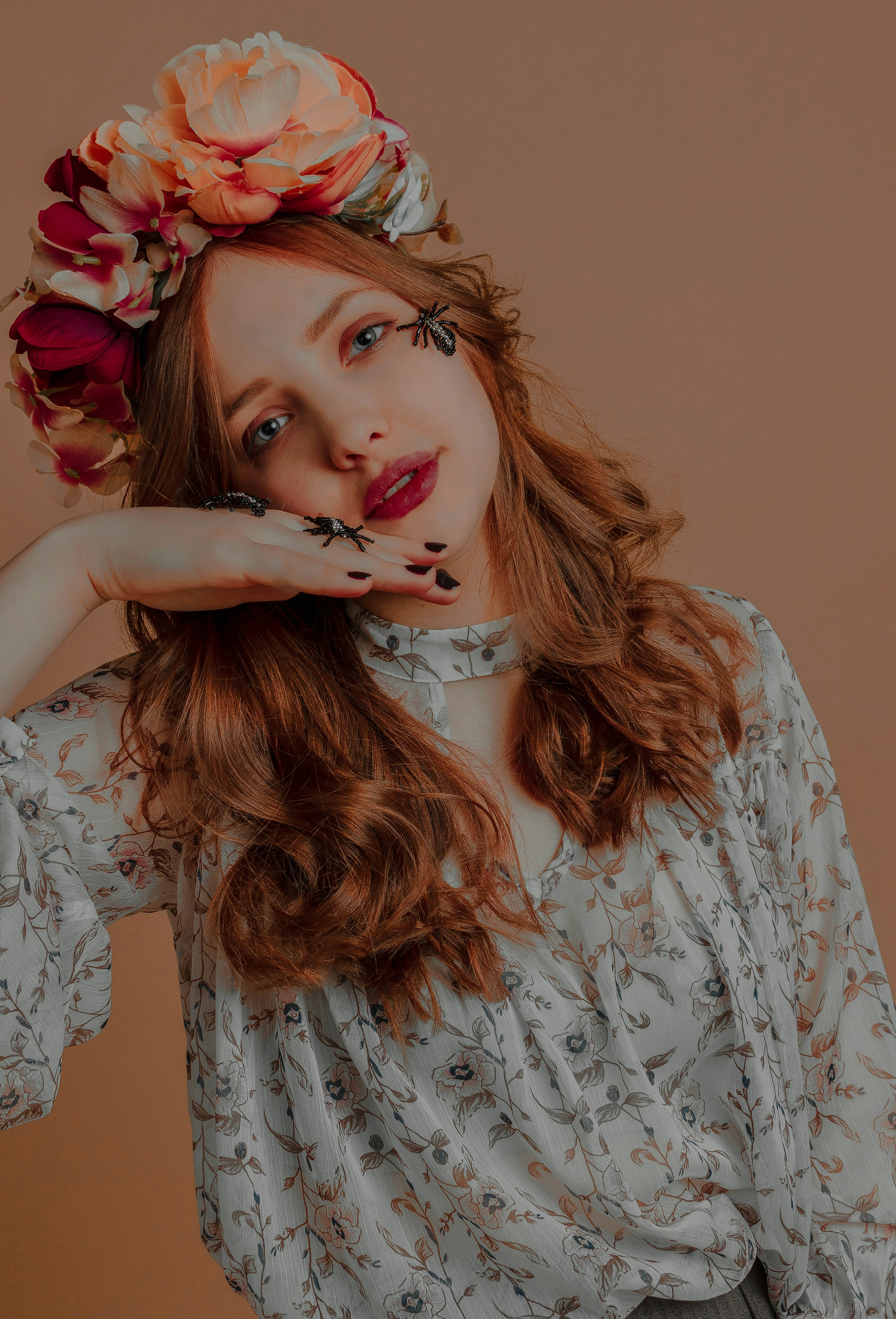 Floral Crown and Quiet Gaze: A Portrait in Soft Warmer Tones