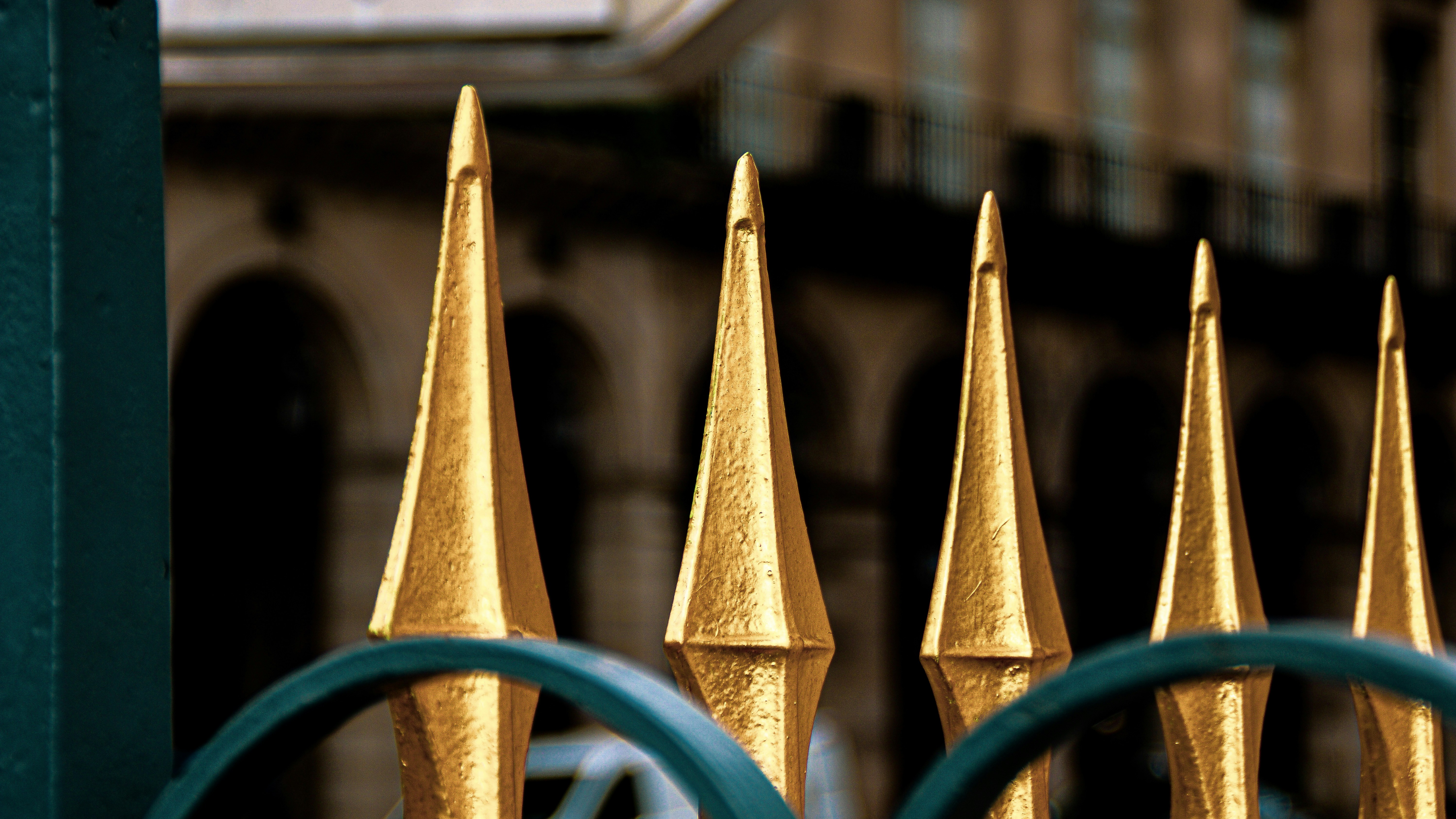 Gilded Spikes Guarding a Quiet Courtyard