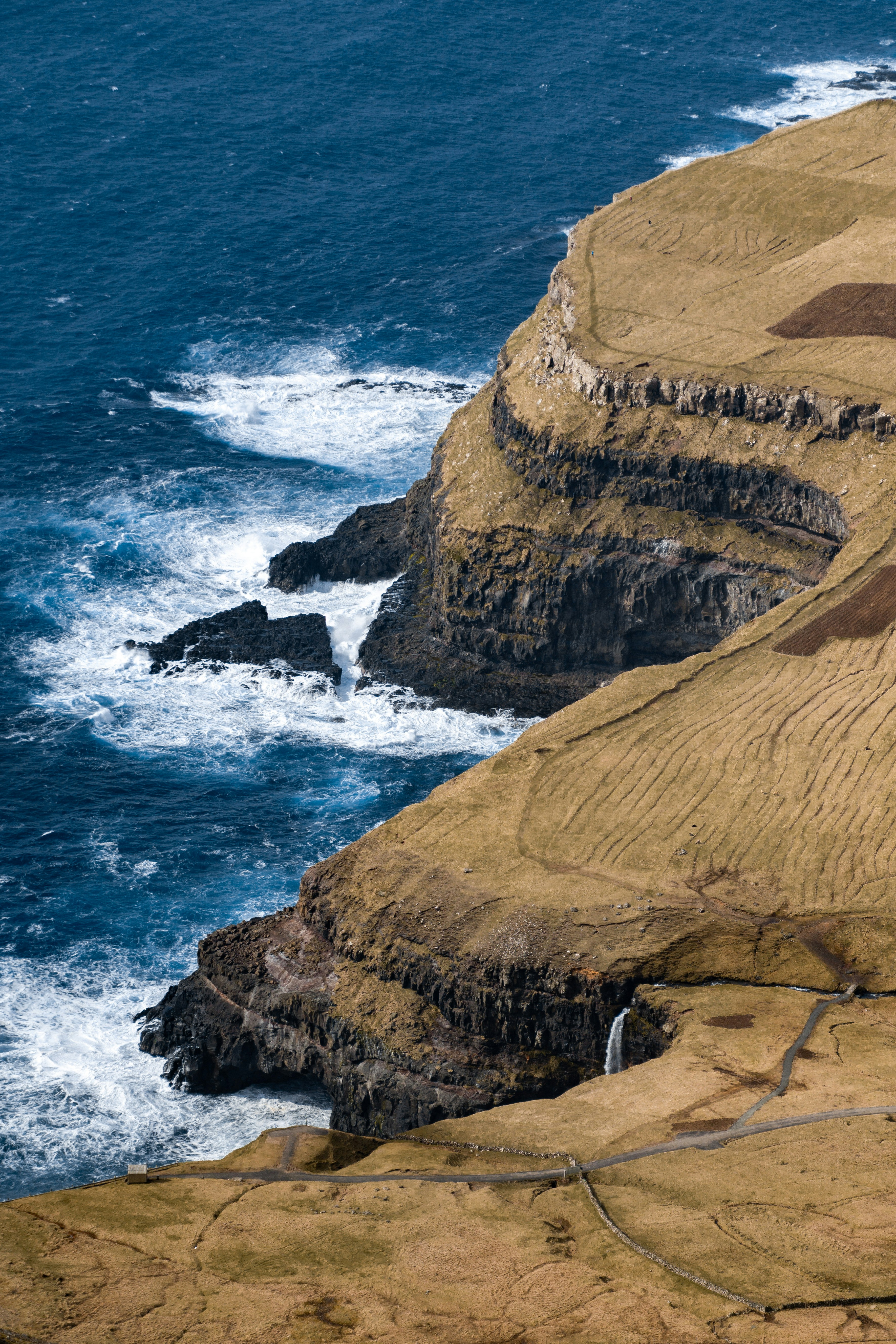 island near ocean during daytime