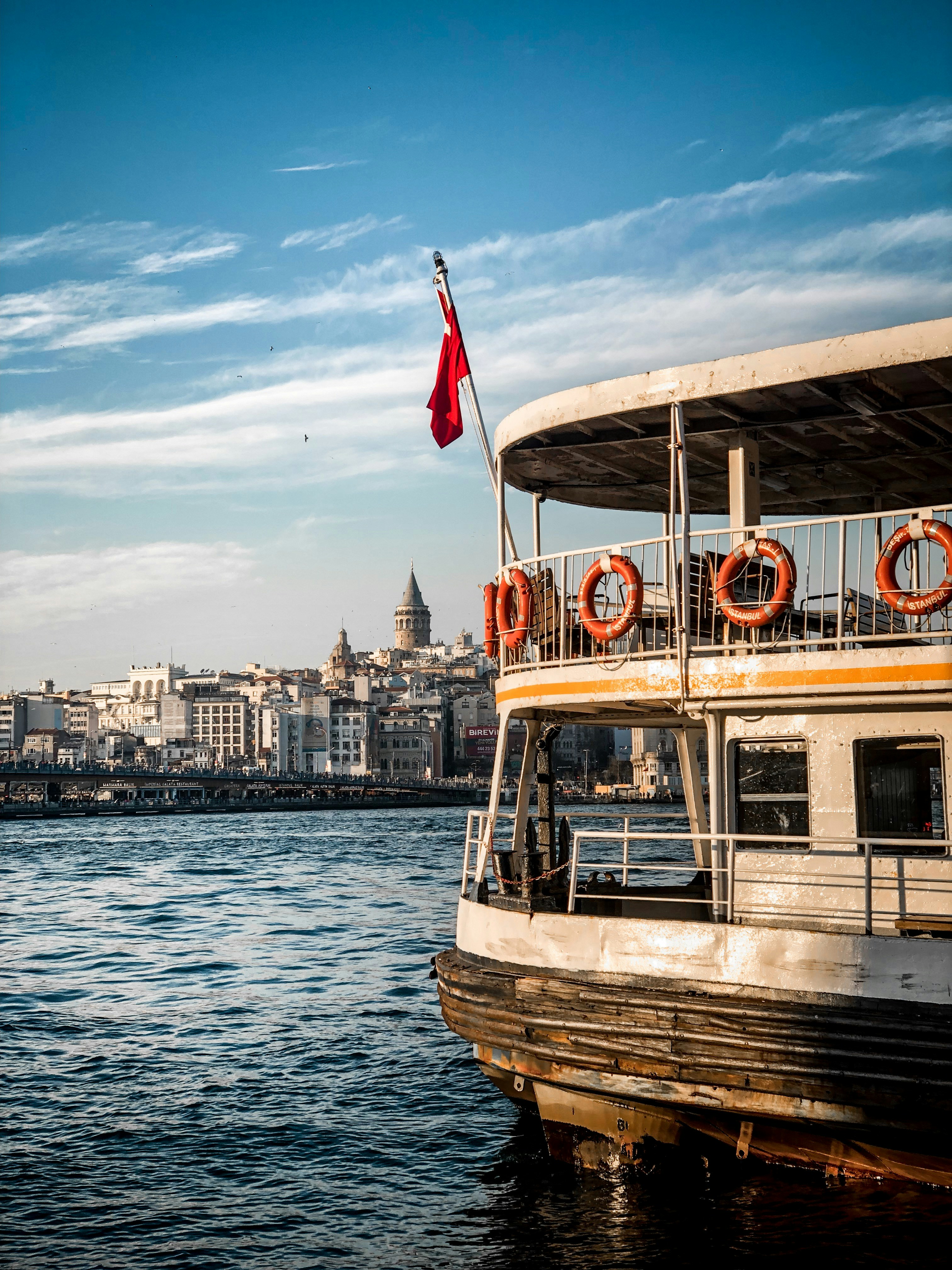 Istanbul Harbor Ferry: Red Lifebuoys and a Distant Skyline