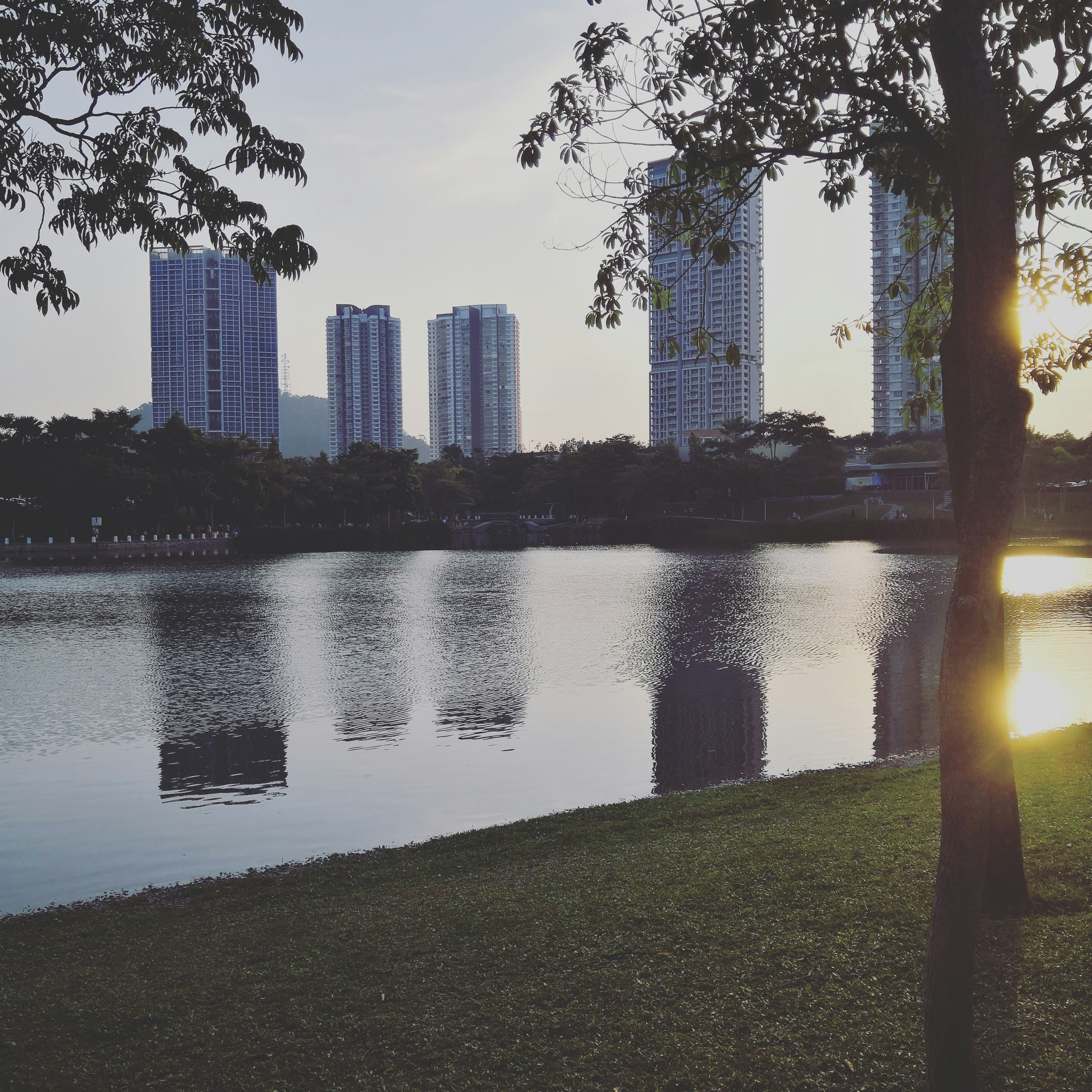 Grey high rise buildings near body of water during daytime photo – Free ...