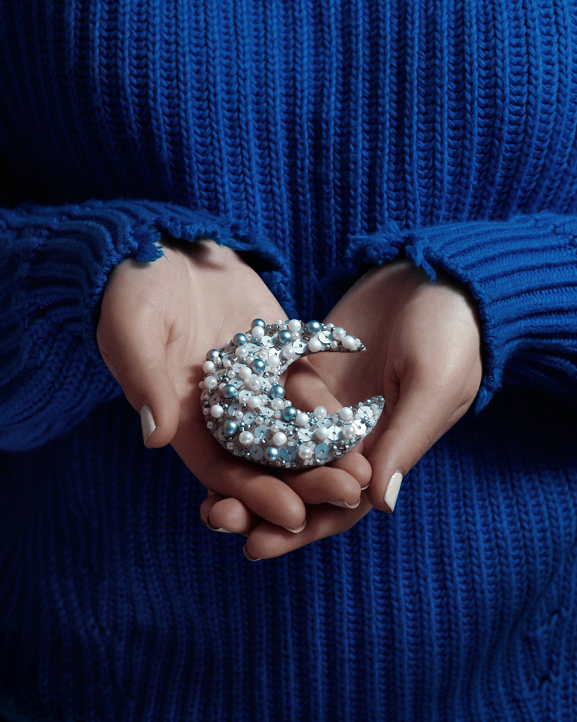Moon-Colored Bead Crescent Cradled in Cobalt Knit