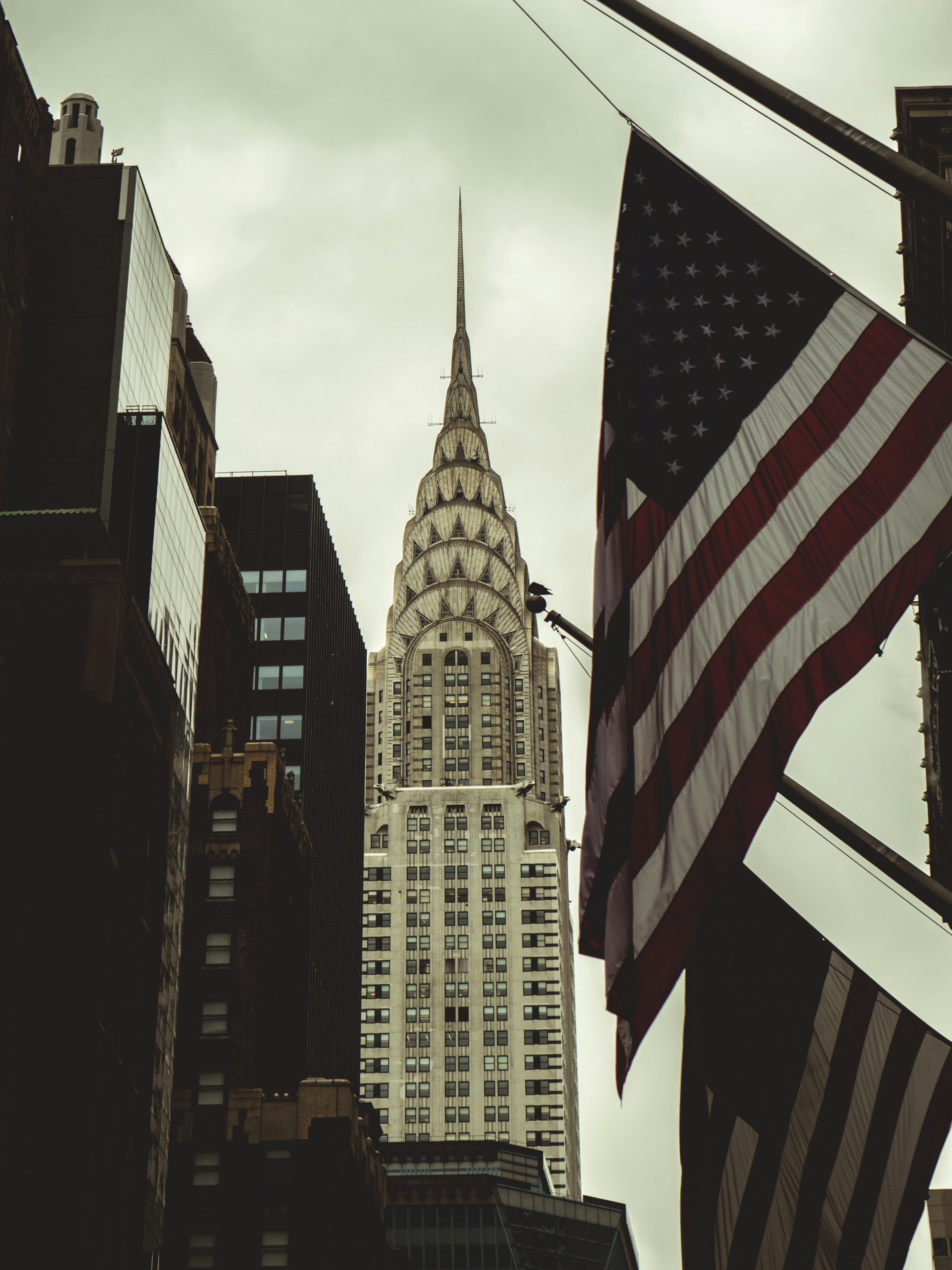 Chrysler’s Needle Amid Flags and Footfall