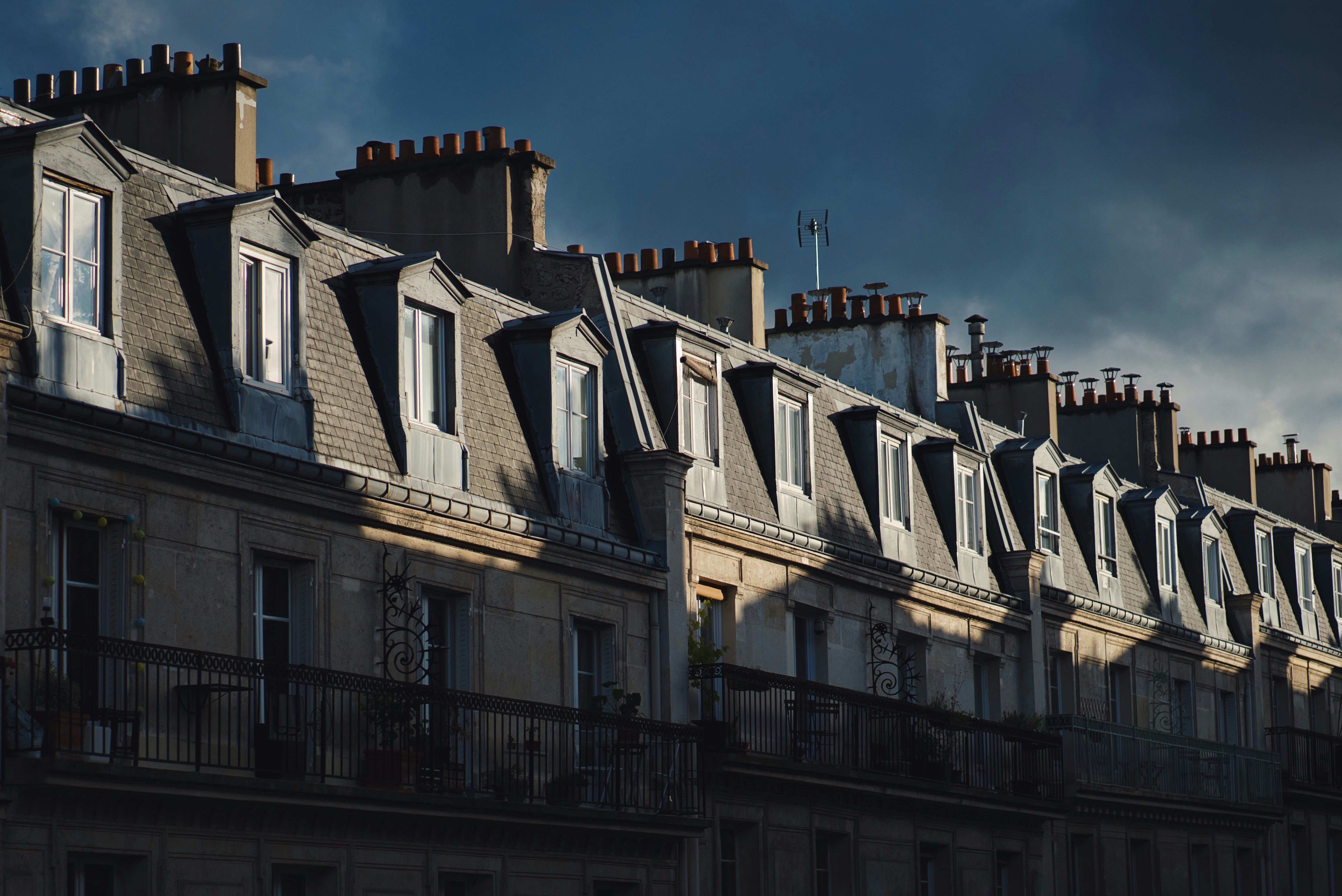 Rooftop Row: Evening Light on Parisian Attics