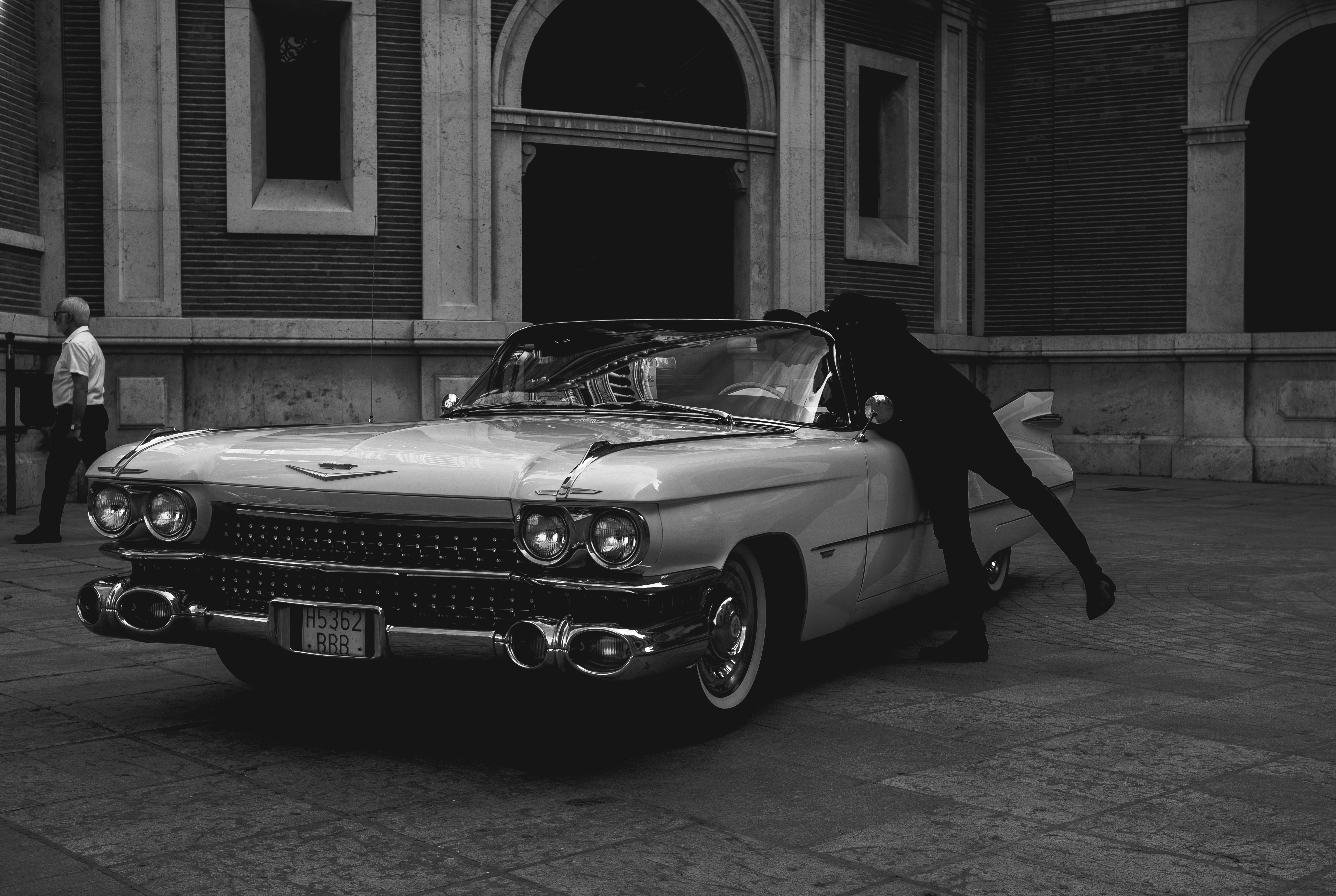 Midnight Noir on Chrome: A 1950s Cadillac at the Arch
