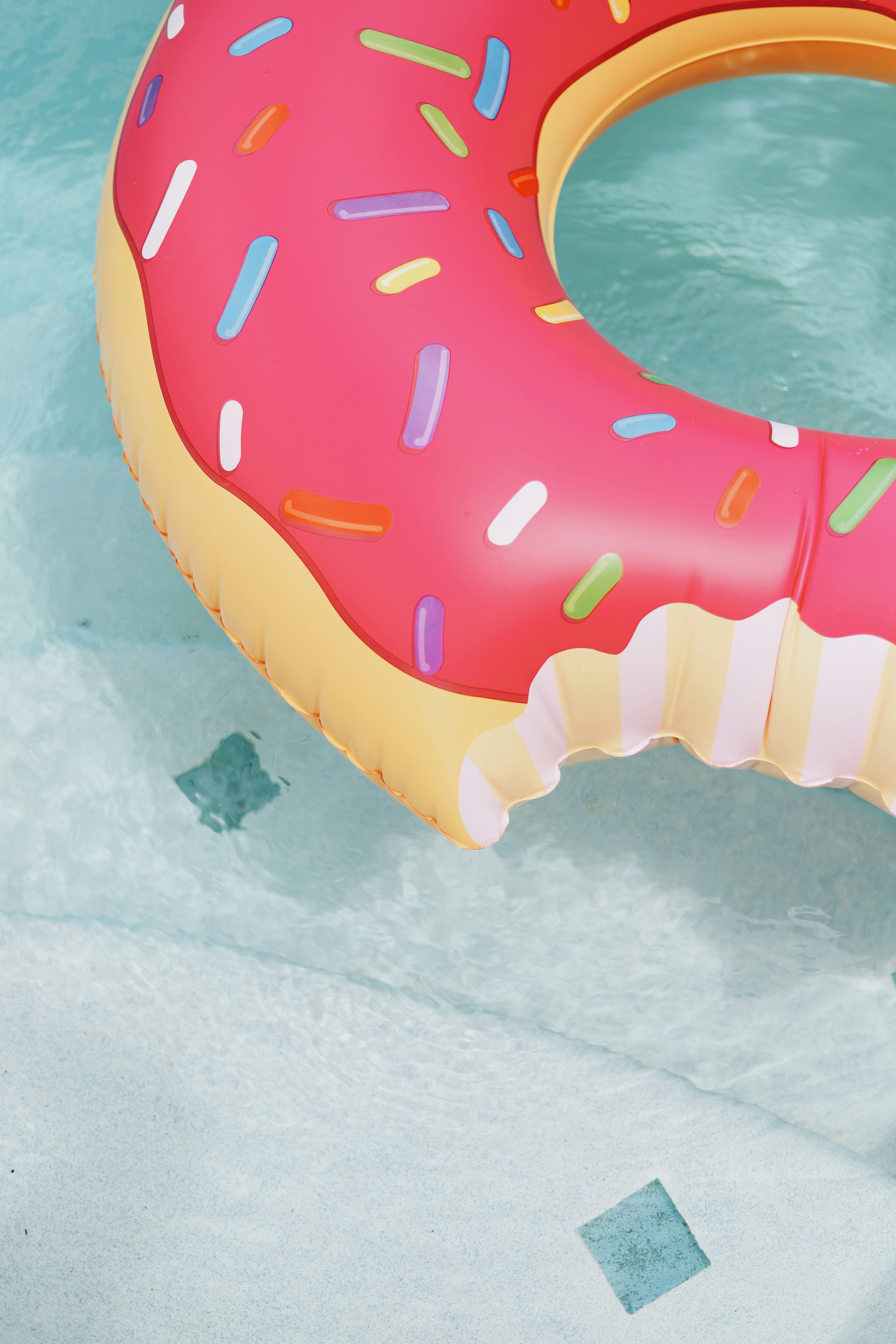 Pink inflatable donut floater photo – Free Beach Image on Unsplash