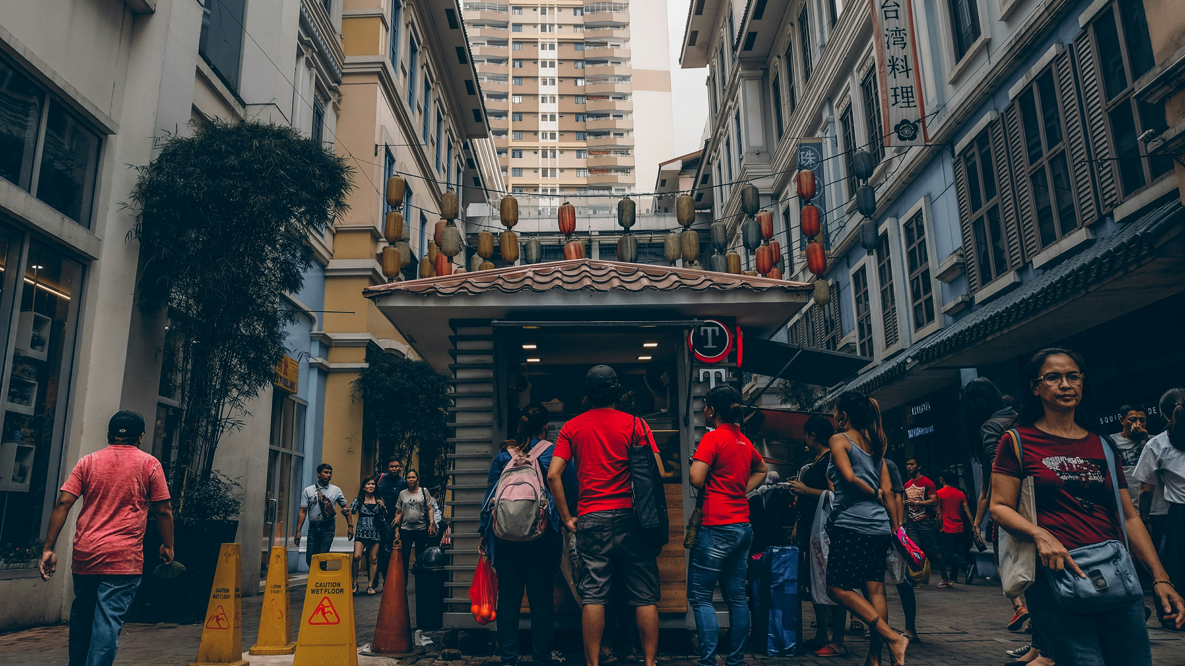 Group of people standing near buildings ] photo – Free Person Image on ...