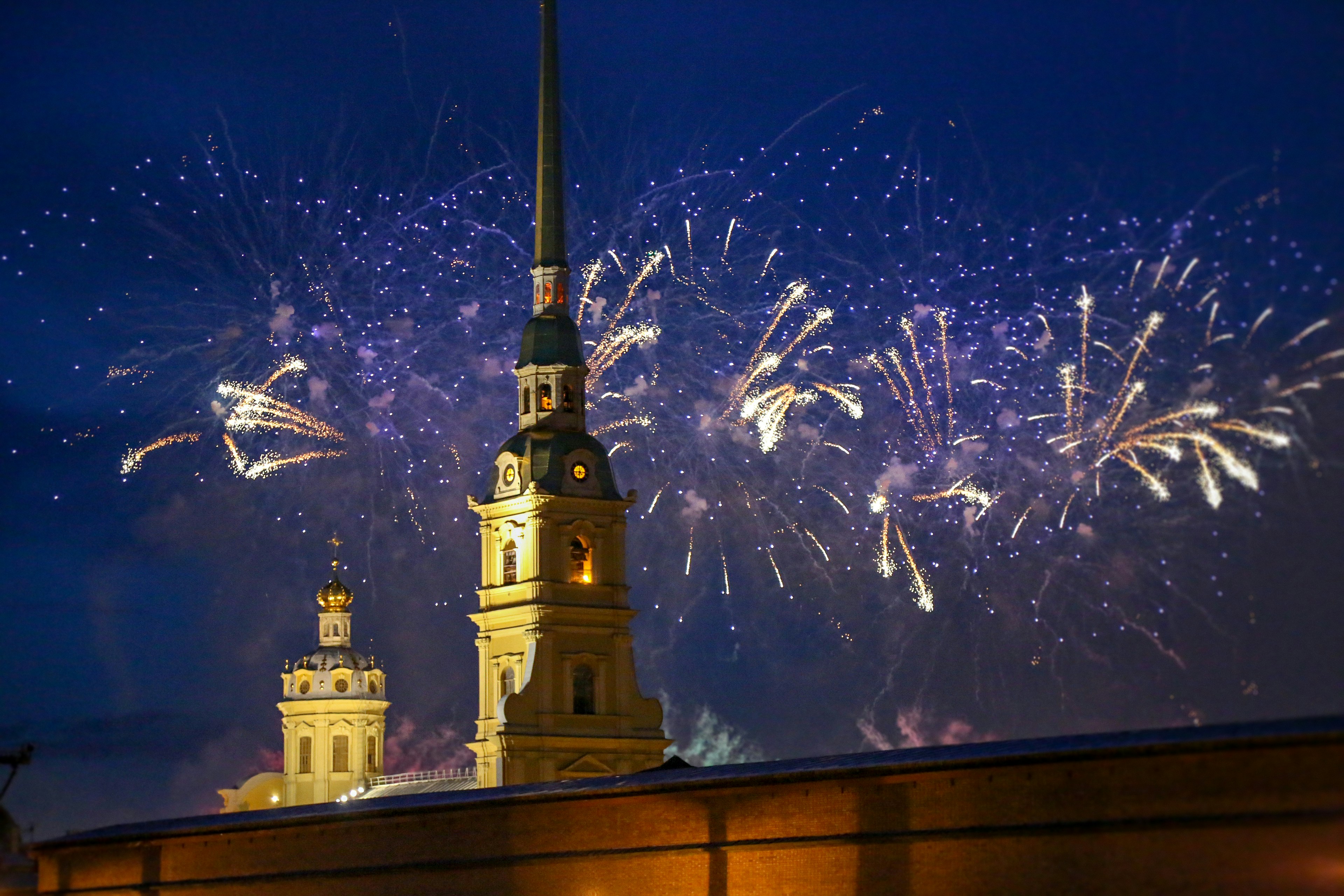 Illuminated Night Over Historic Towers