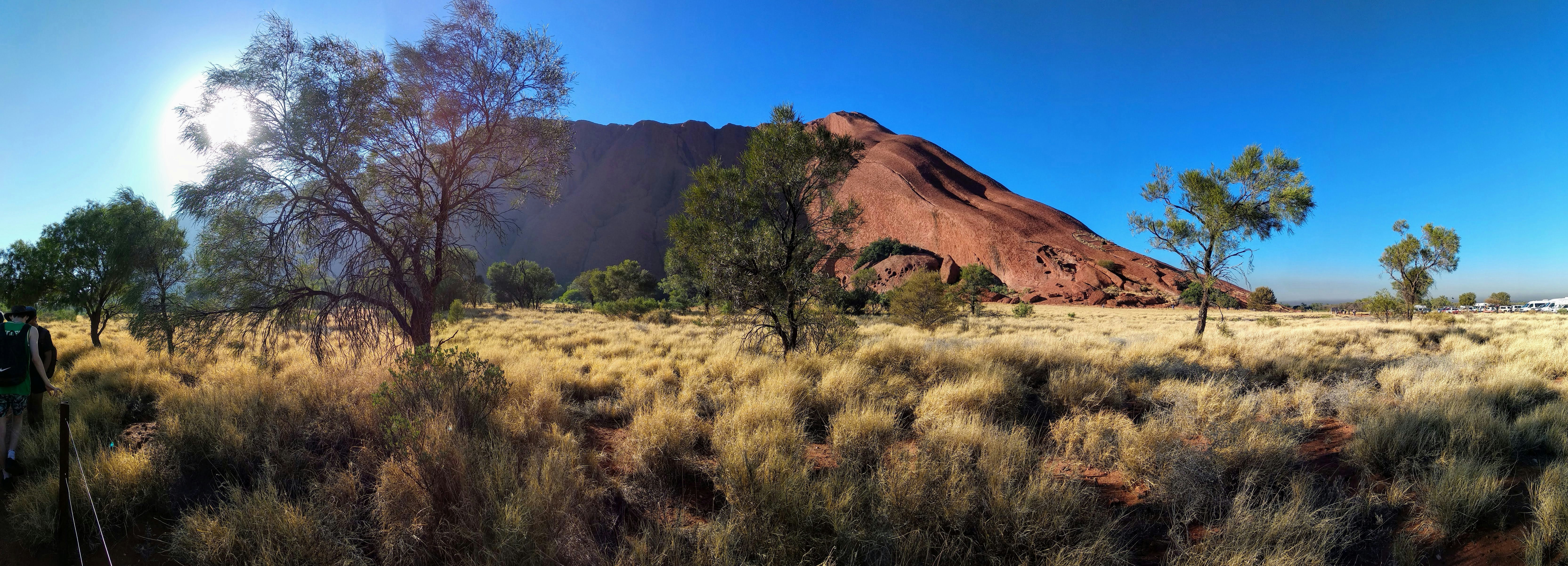 brown mountain at the plains under clear blue sky