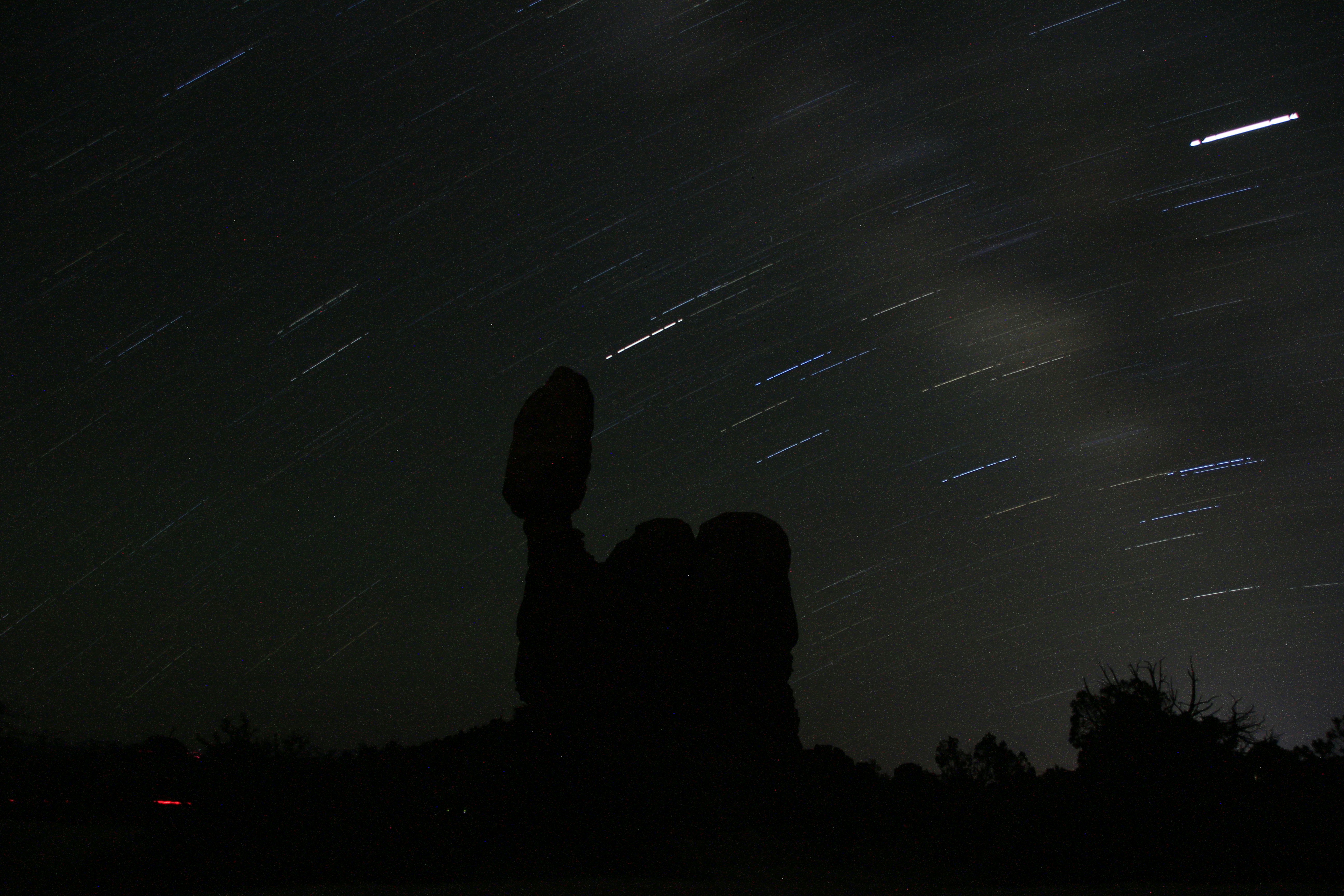 Two-Headed Monolith Under a Veil of Star Trails