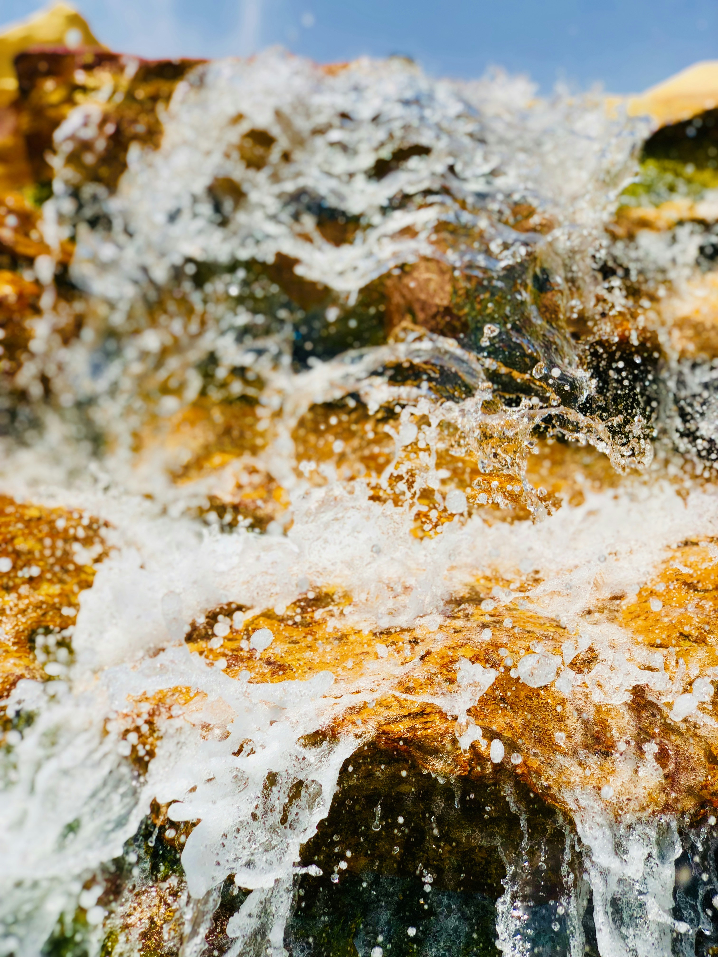 Rushing Cascade of Orange Rock and White Foam