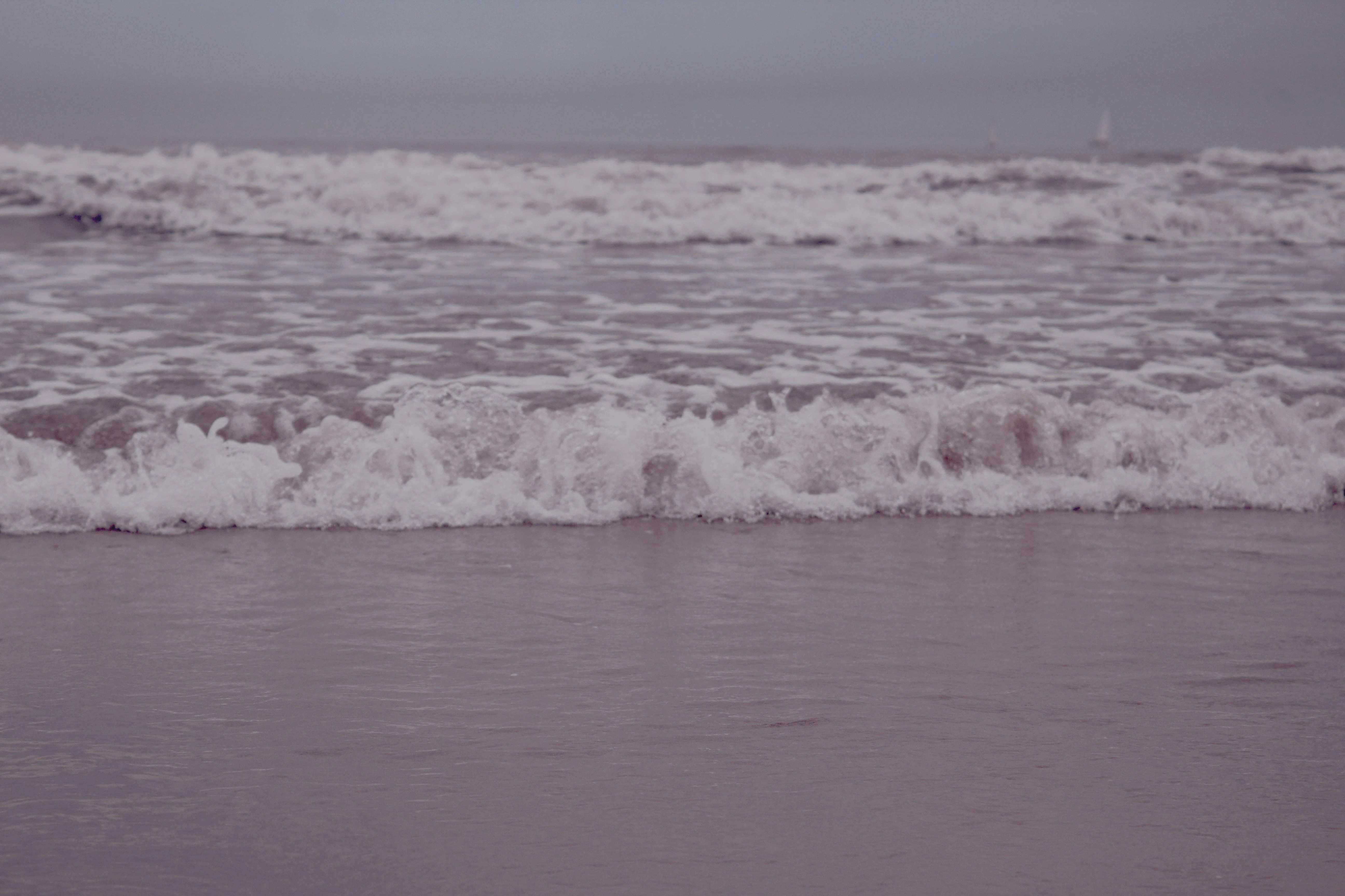 Lilac Tide: Quiet Breakers at a Dusk-Tinted Shore