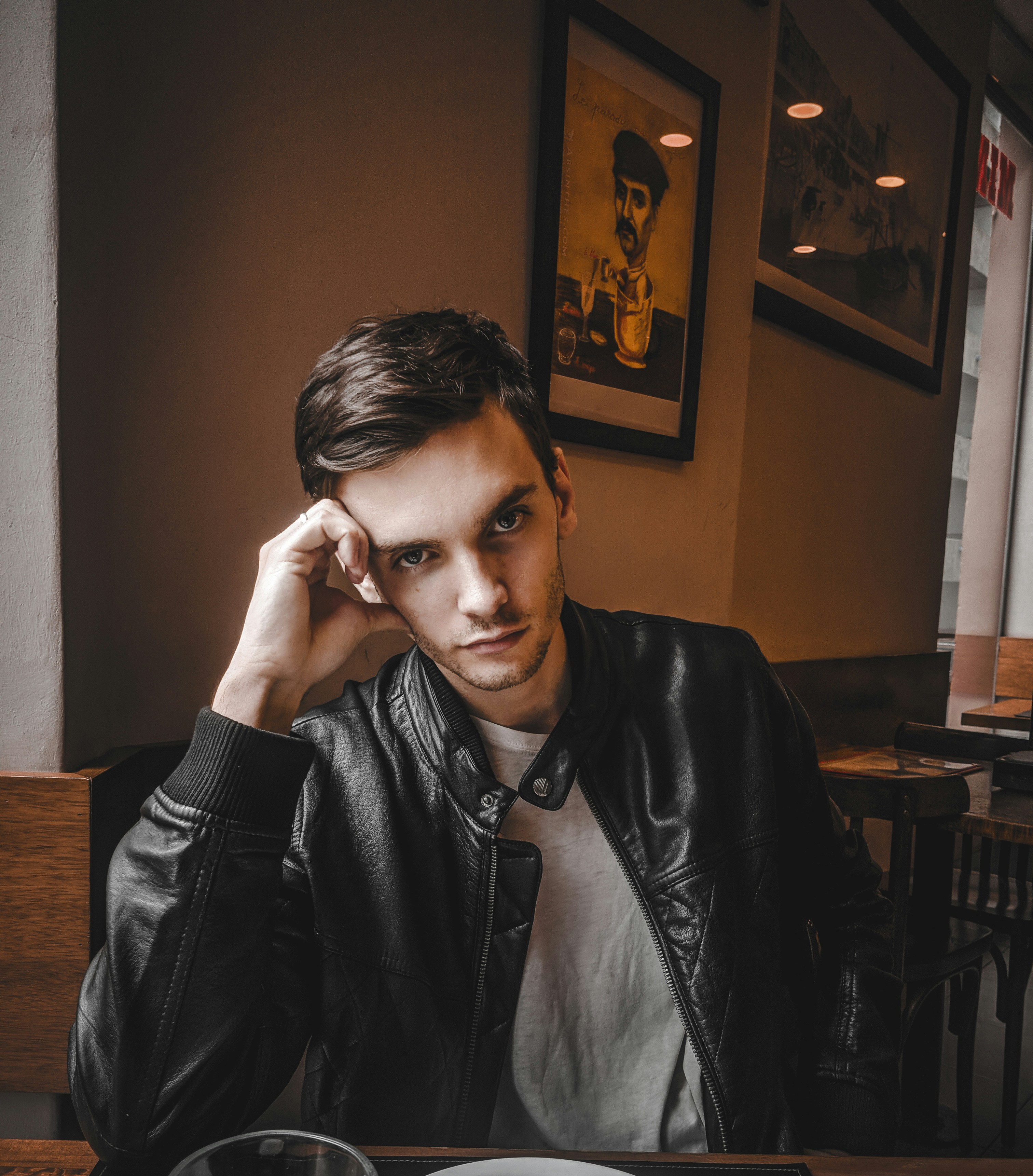 Man sitting on chair in front of table photo – Free Table Image on Unsplash