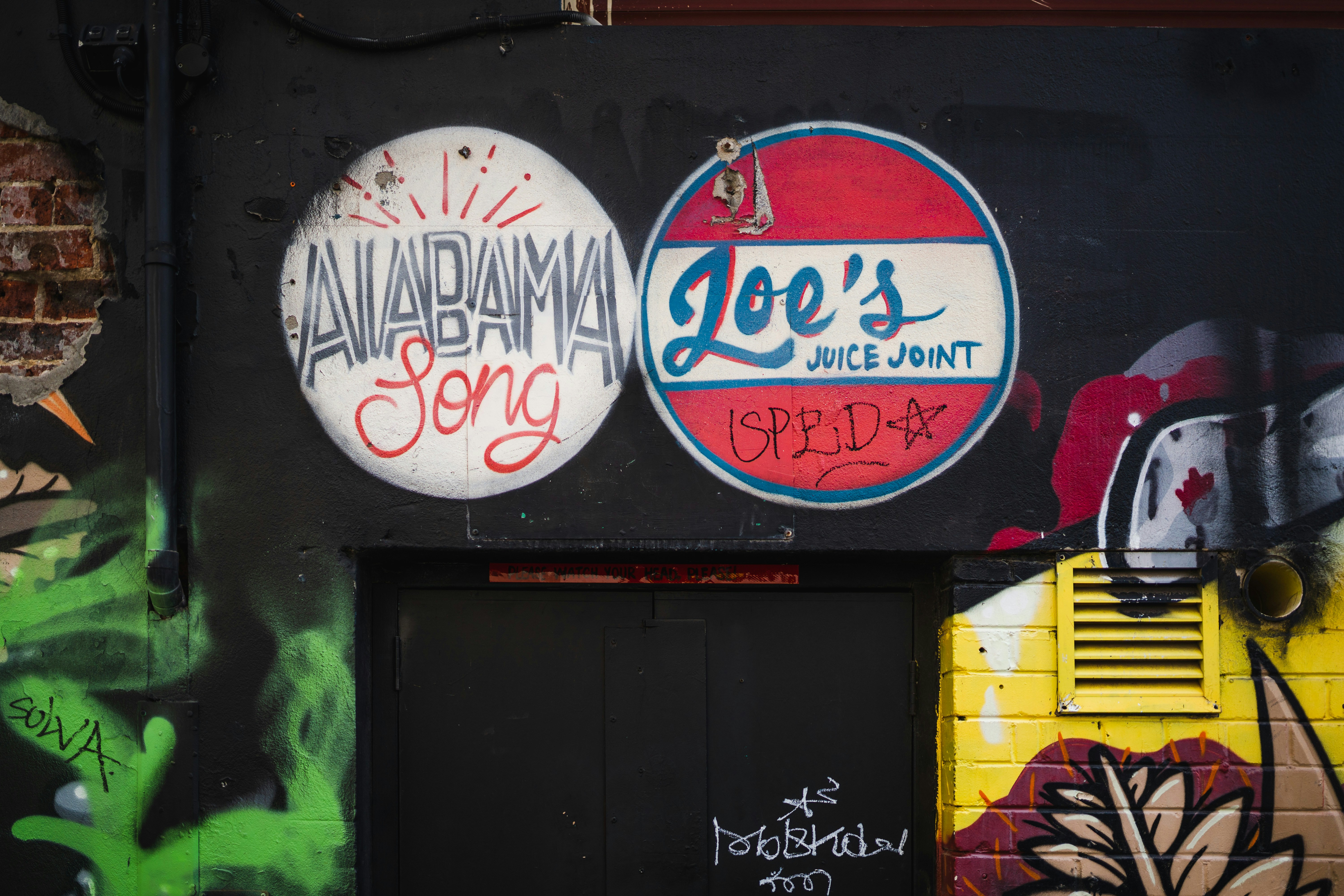 A wall with a bunch of graffiti on it photo – Free Perth Image on Unsplash