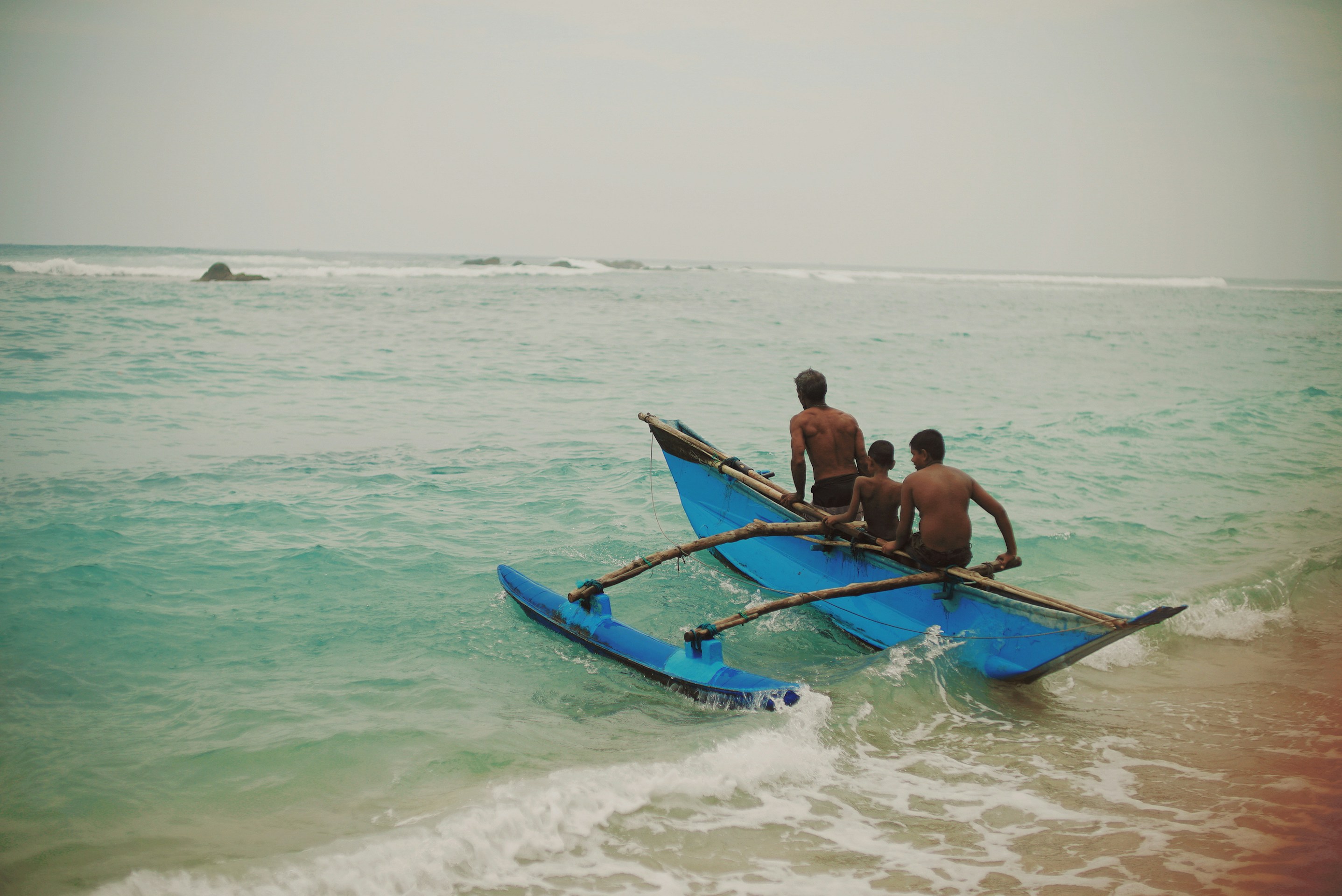 Three in a Blue Raft Taming Turquoise Waves